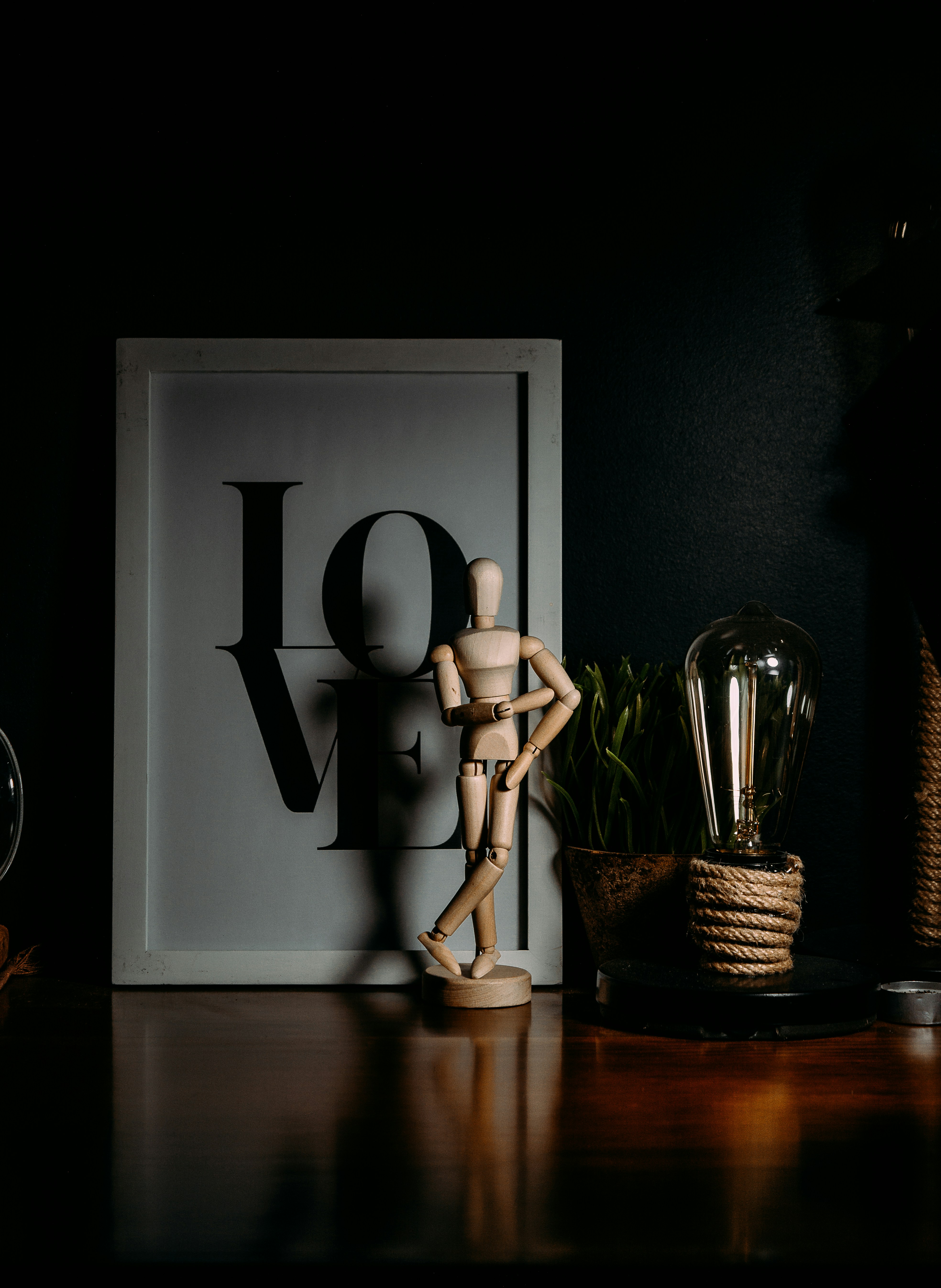 Shadowed Still Life: A Wooden Figure Guards the Love of Light