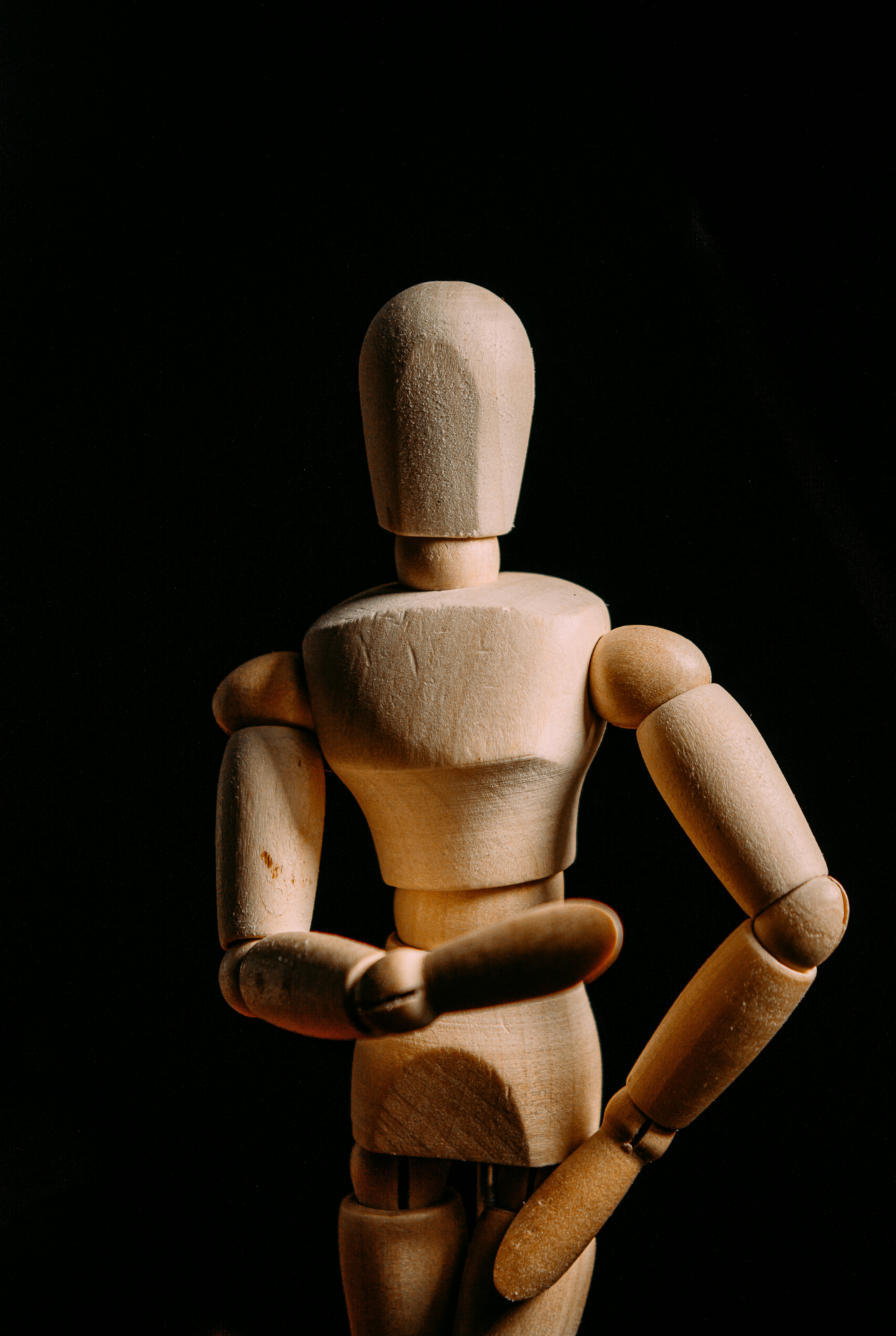 Brown wooden human figure on black textile photo – Free Toy Image on ...