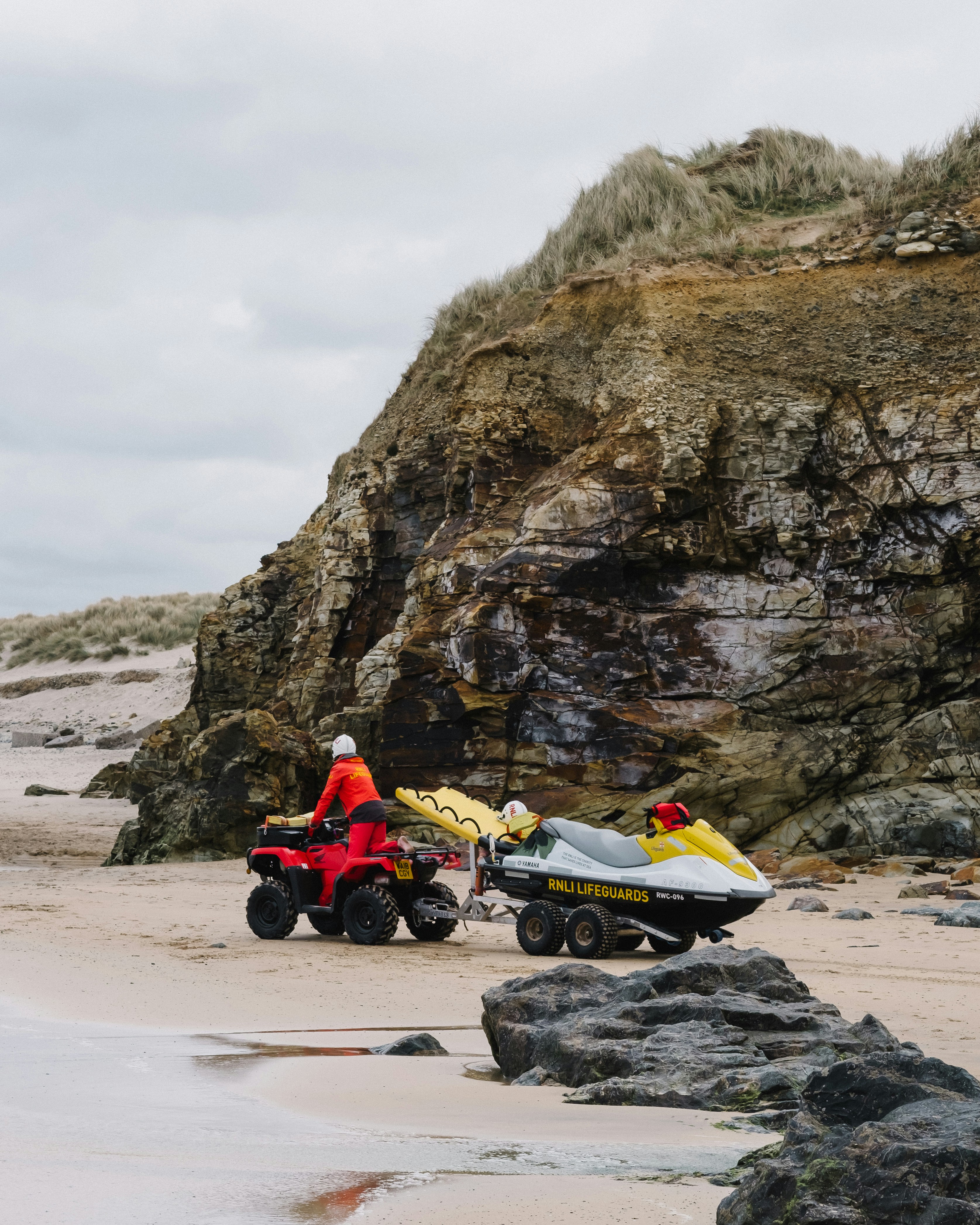 A person riding a four wheeler on a beach photo – Free Cornwall Image ...