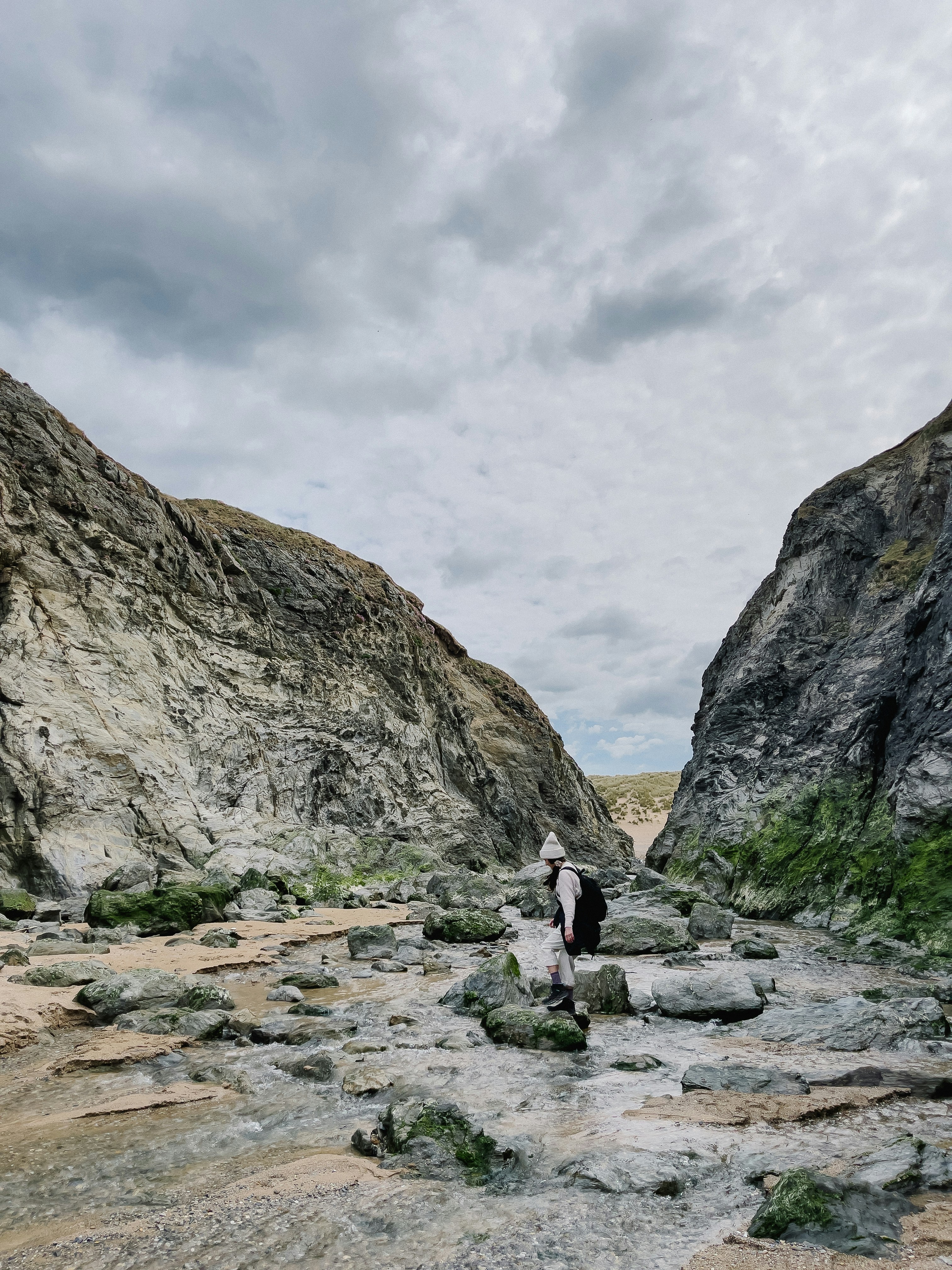 Slate Gorge Stroll: A lone traveler navigates a stony canyon
