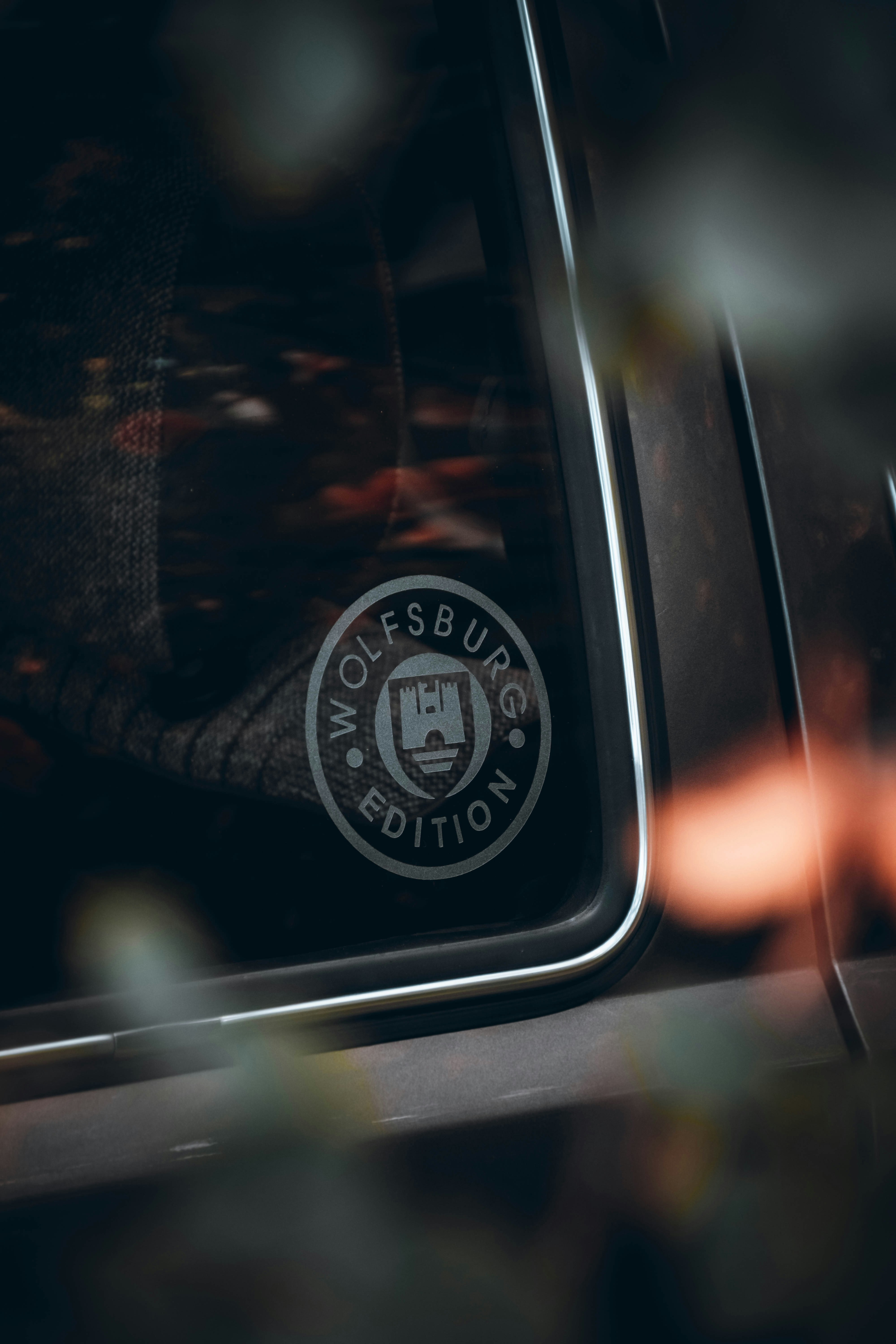 Wolfsburg Edition Seal on the Car Window: Subtle Branding in Soft Focus