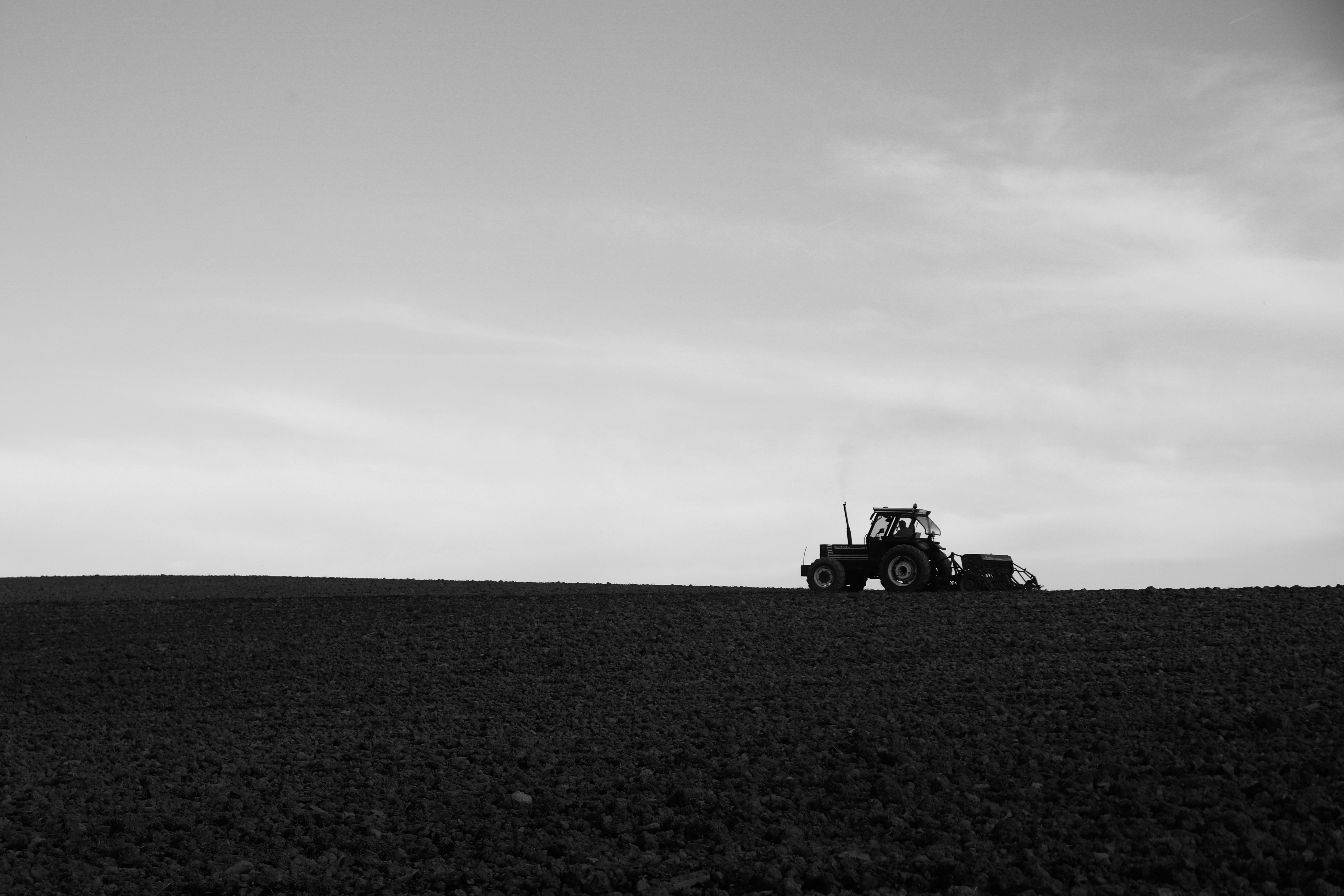 Grayscale photo of a truck on a field photo – Free Tractor Image on ...