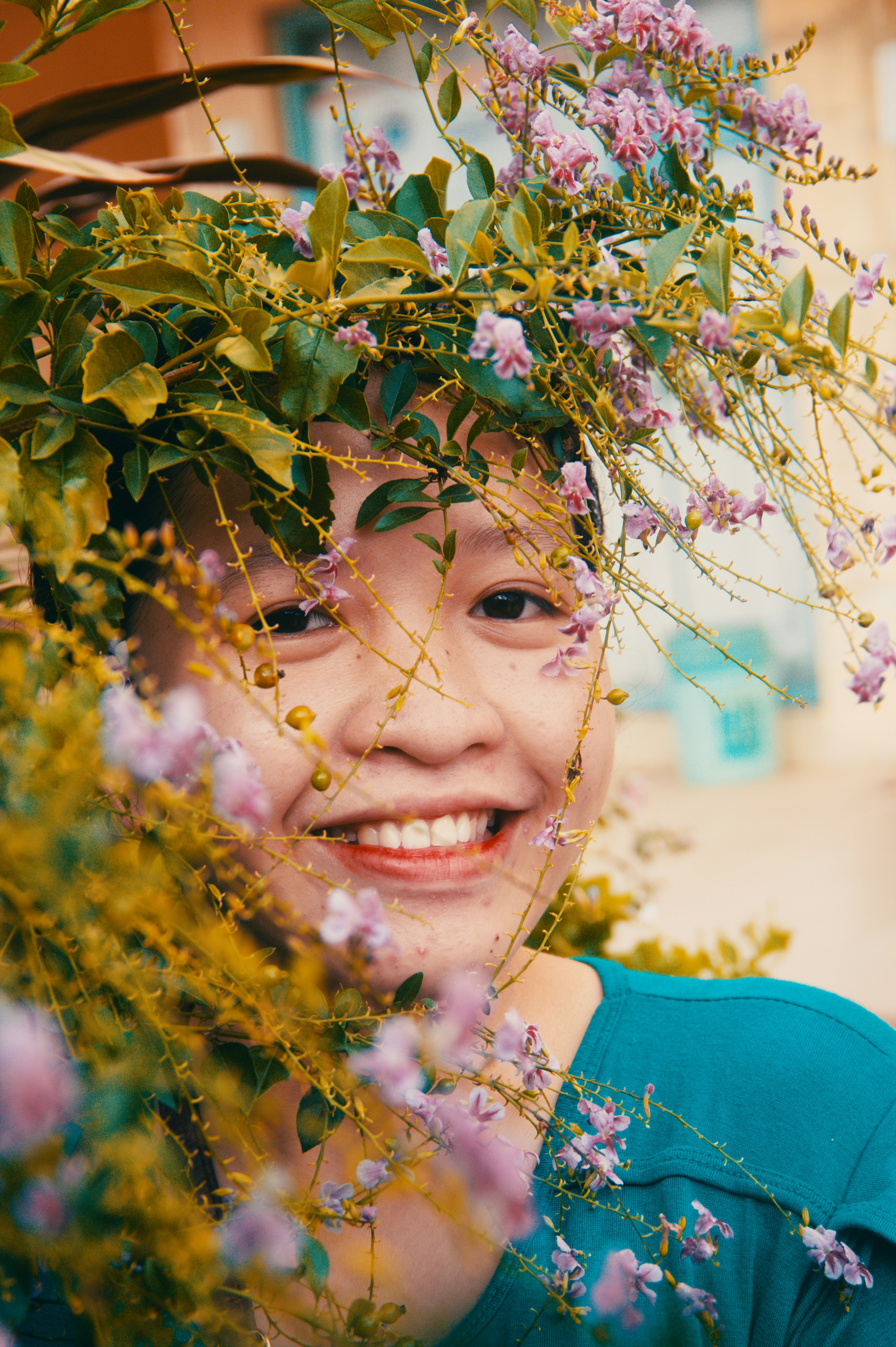 Smiling Portrait Framed by Blossom Veils