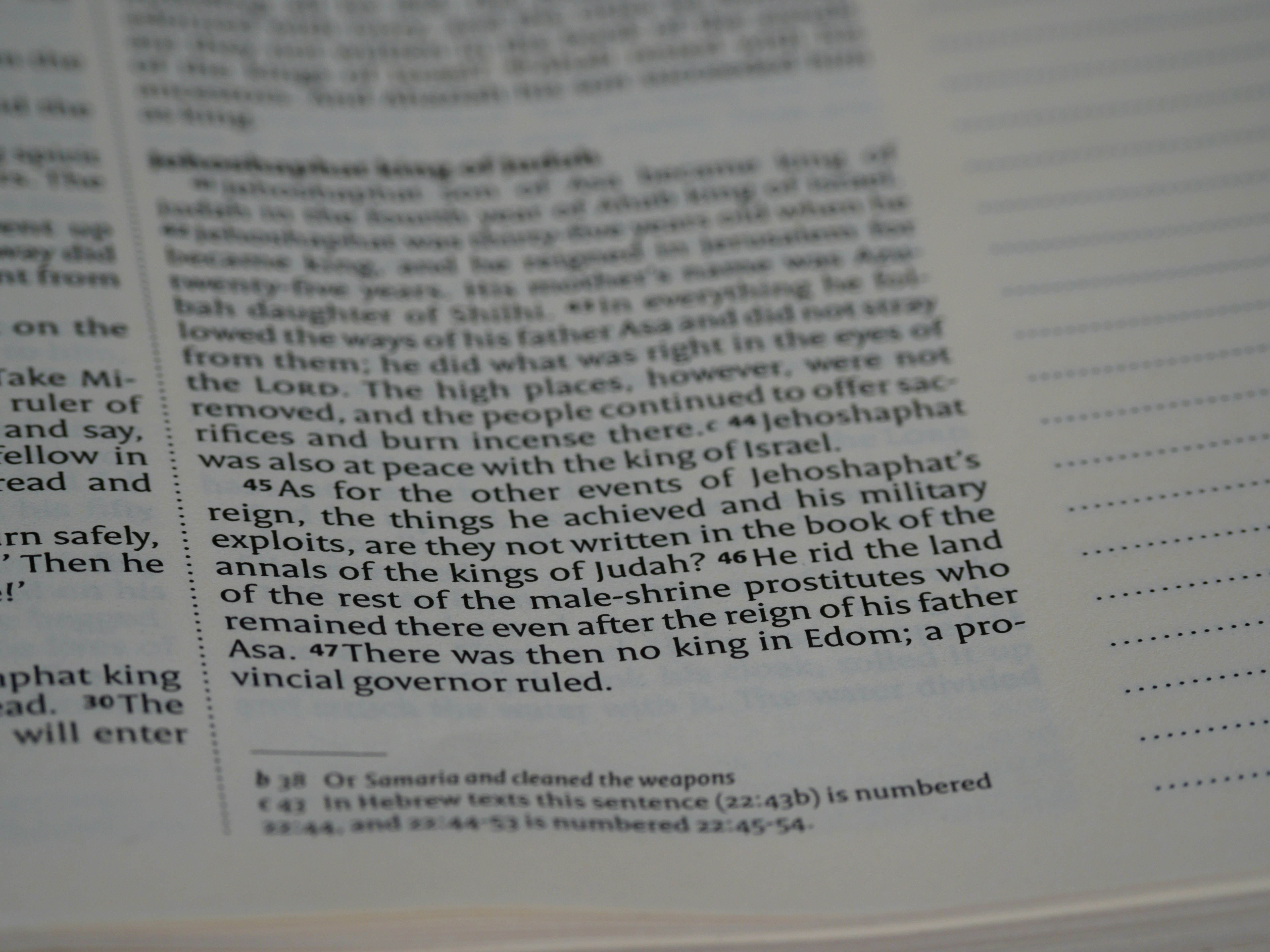 Open book page featuring biblical text and annotations, highlighting historical events and narratives.