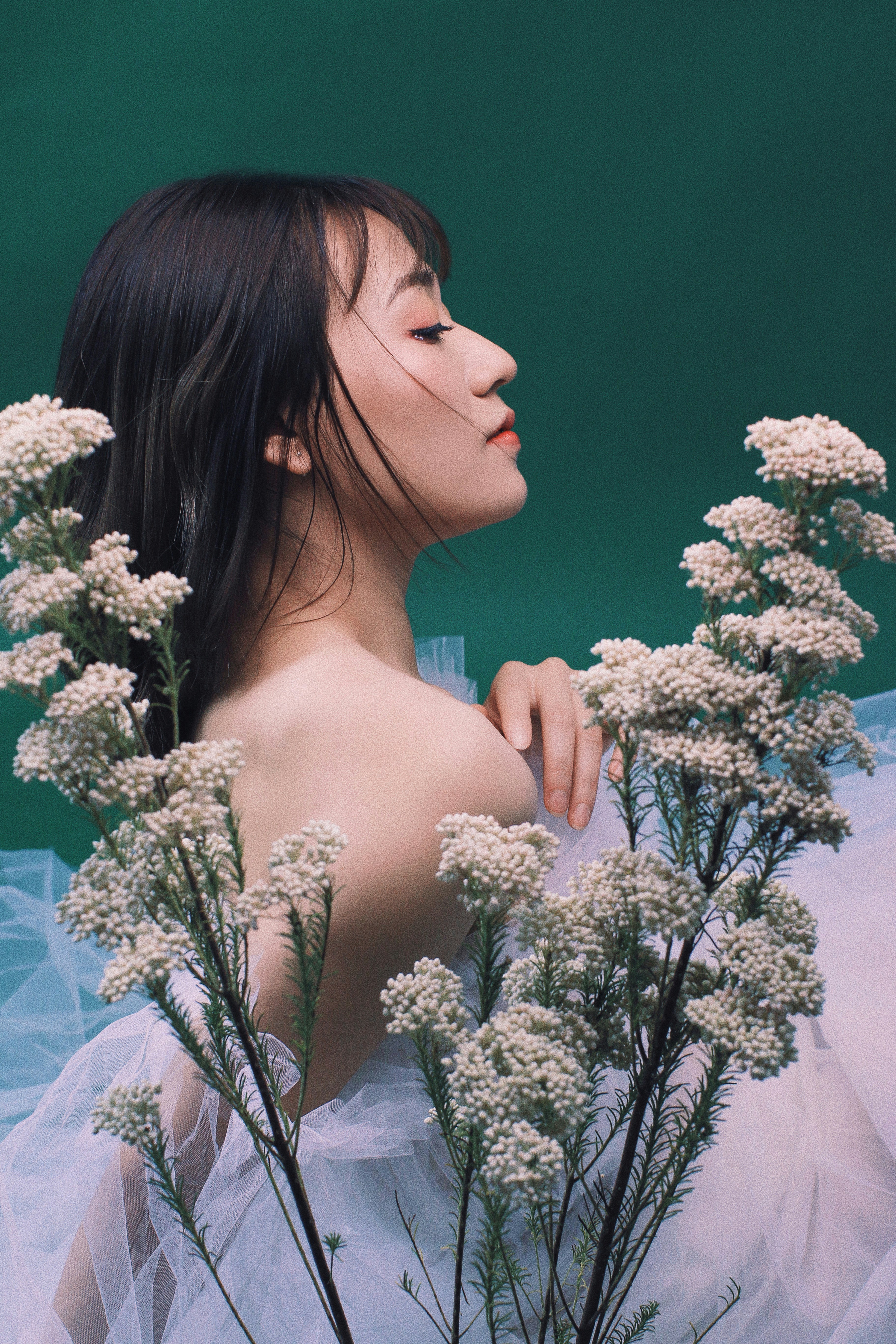 Profile in Petal Veil: Serene Portrait Among White Florals