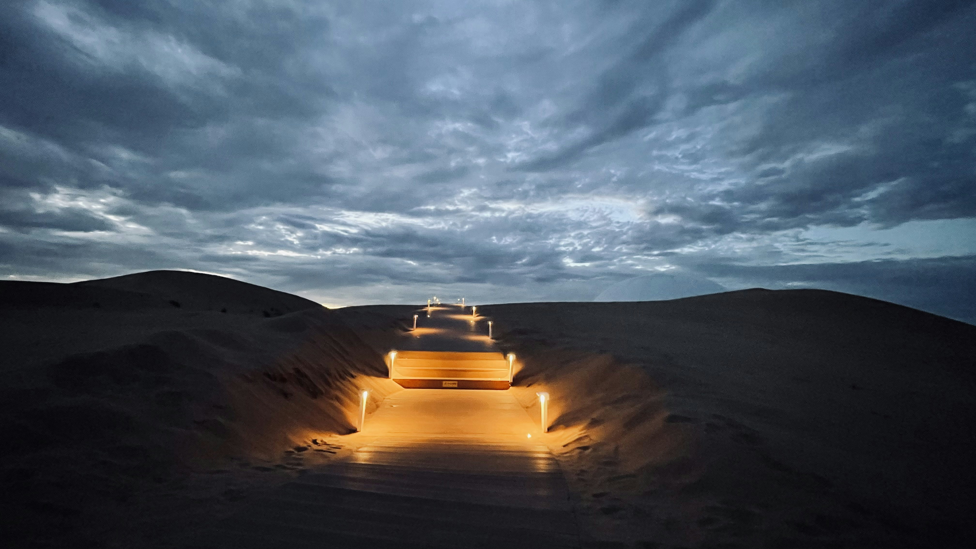 white car on road during night time