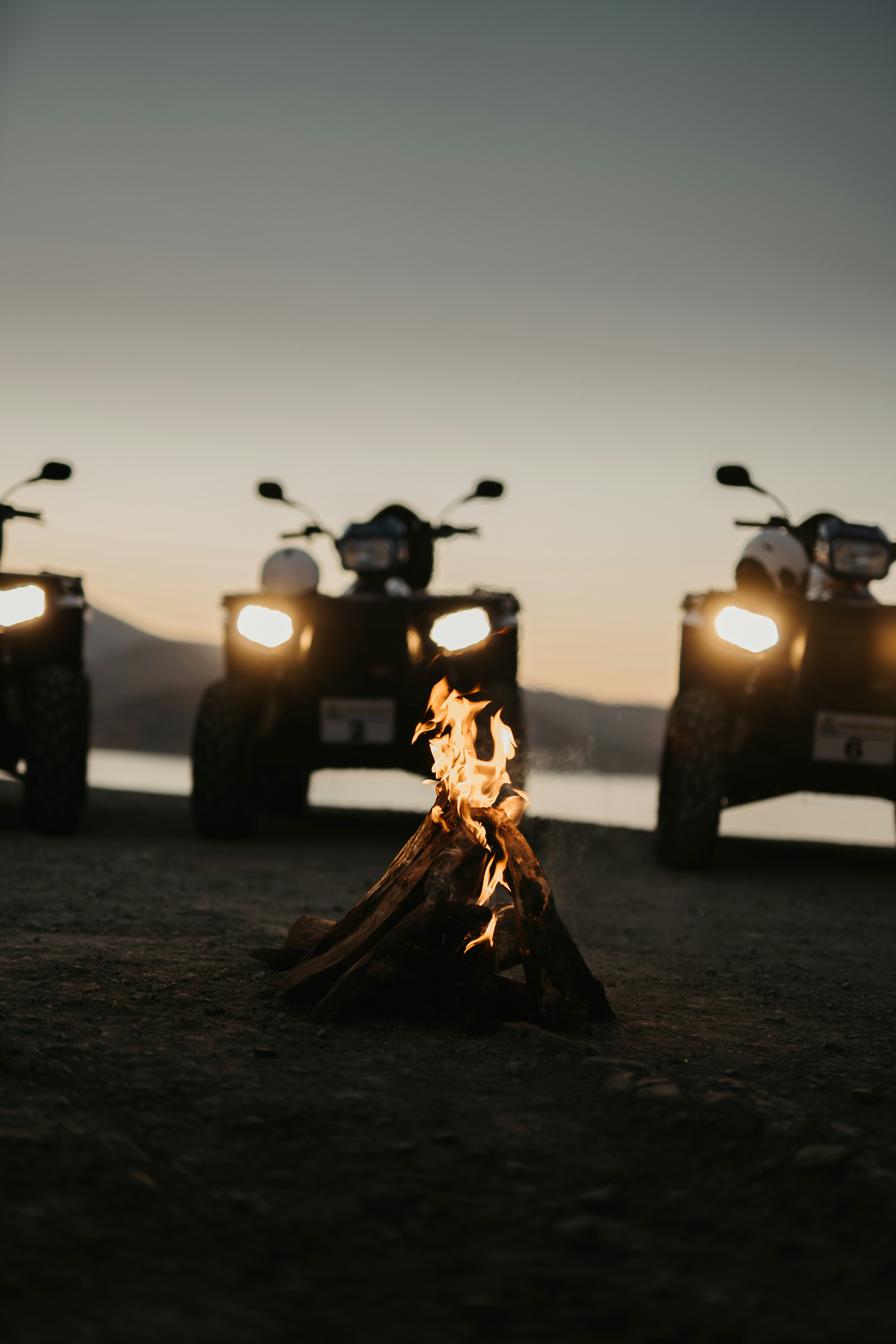fire in the middle of the road during sunset