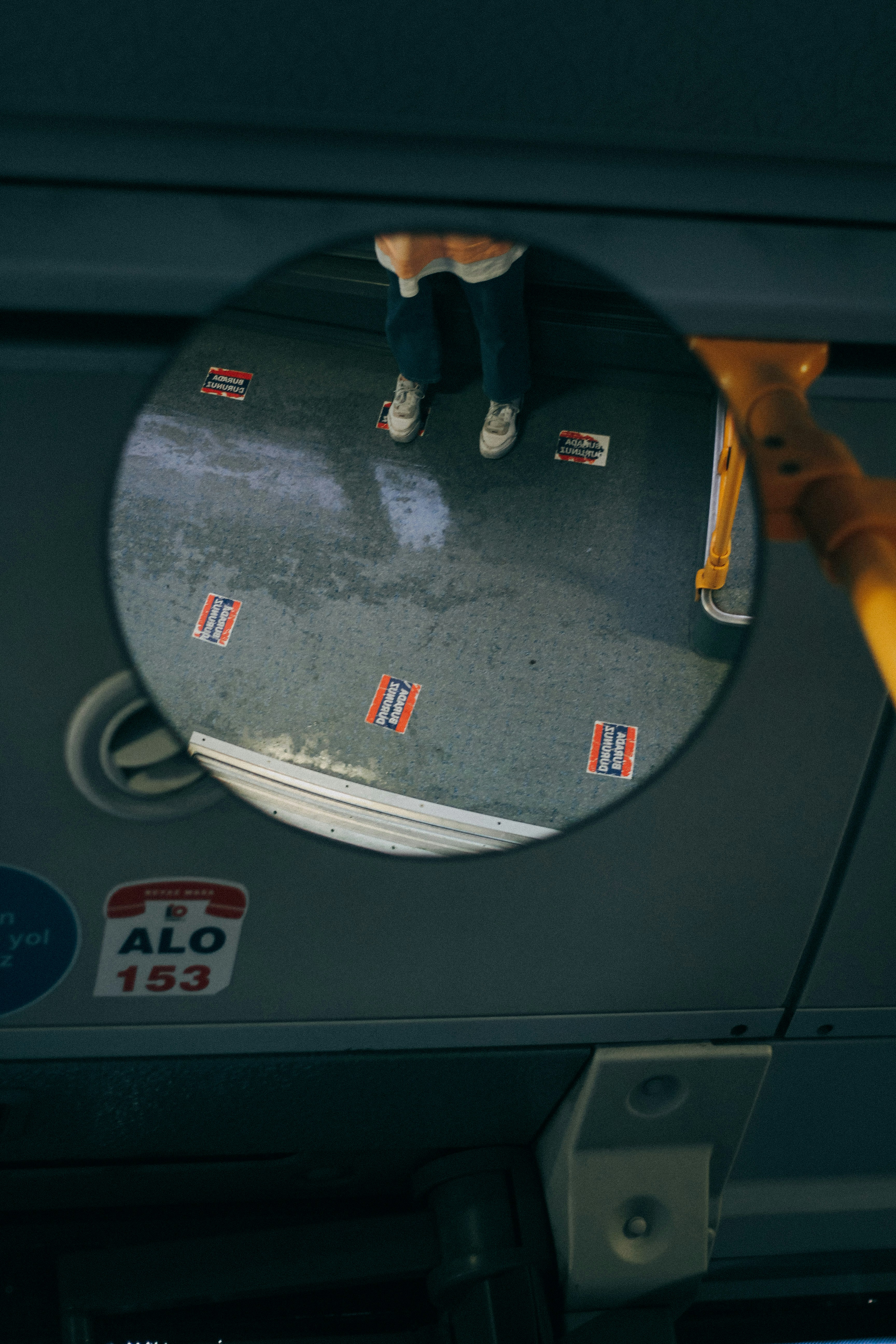 Circular View: Feet Reflected in a Laundry-Door Mirror