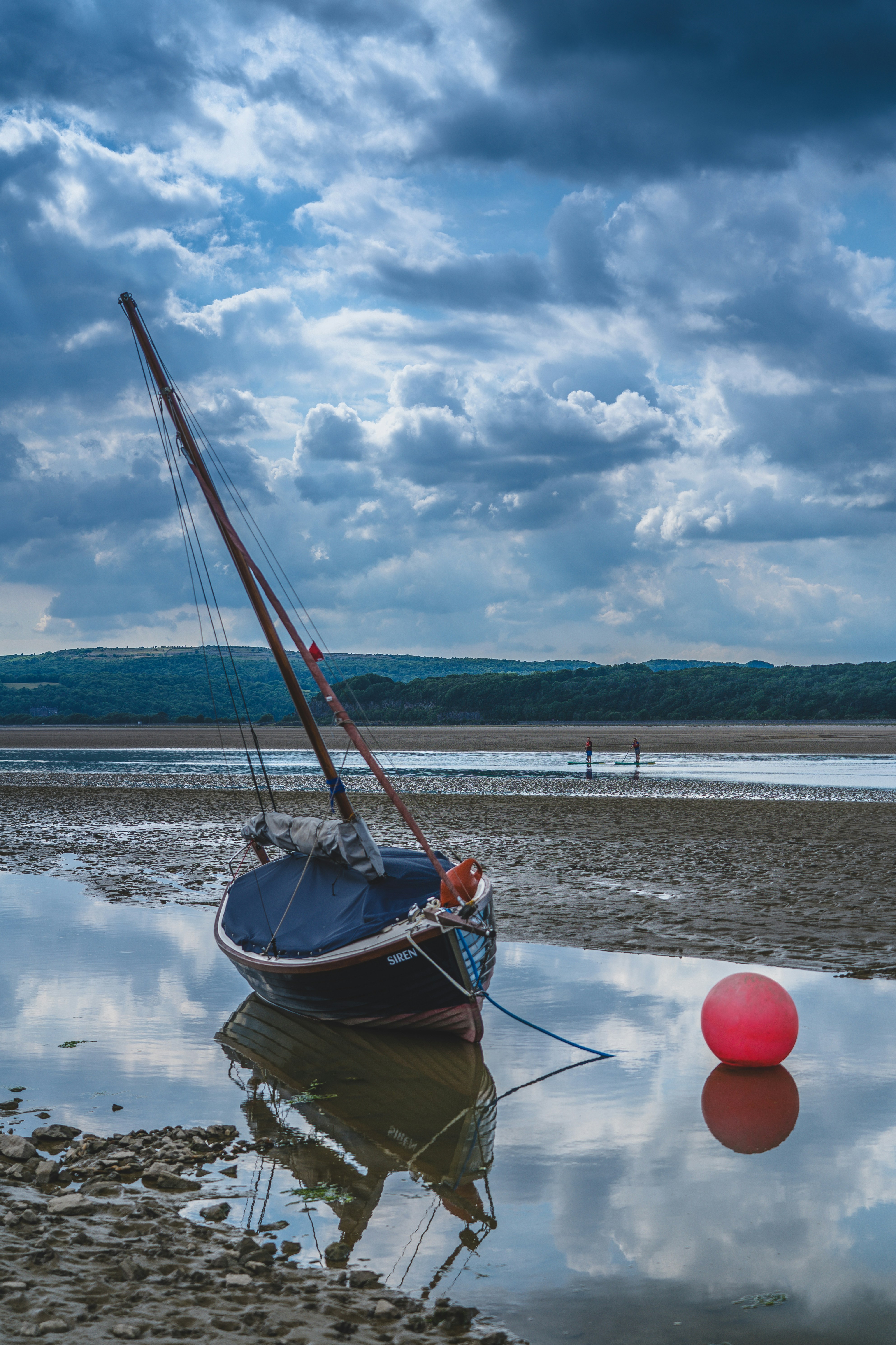 Sailboat at the Mudflats: Echoes of Tide and Sky