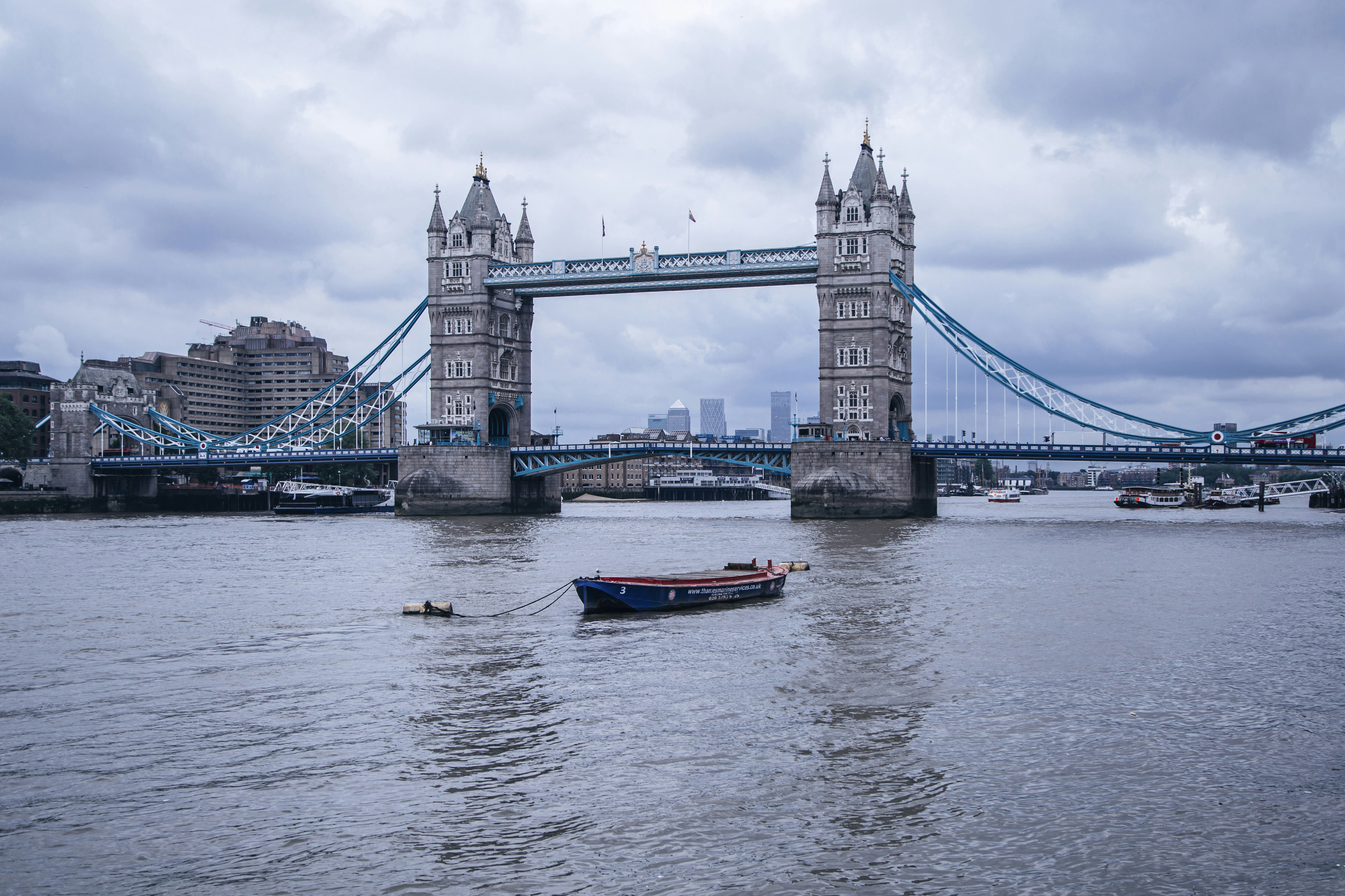 Red boat on water under bridge during daytime photo – Free Bridge Image ...