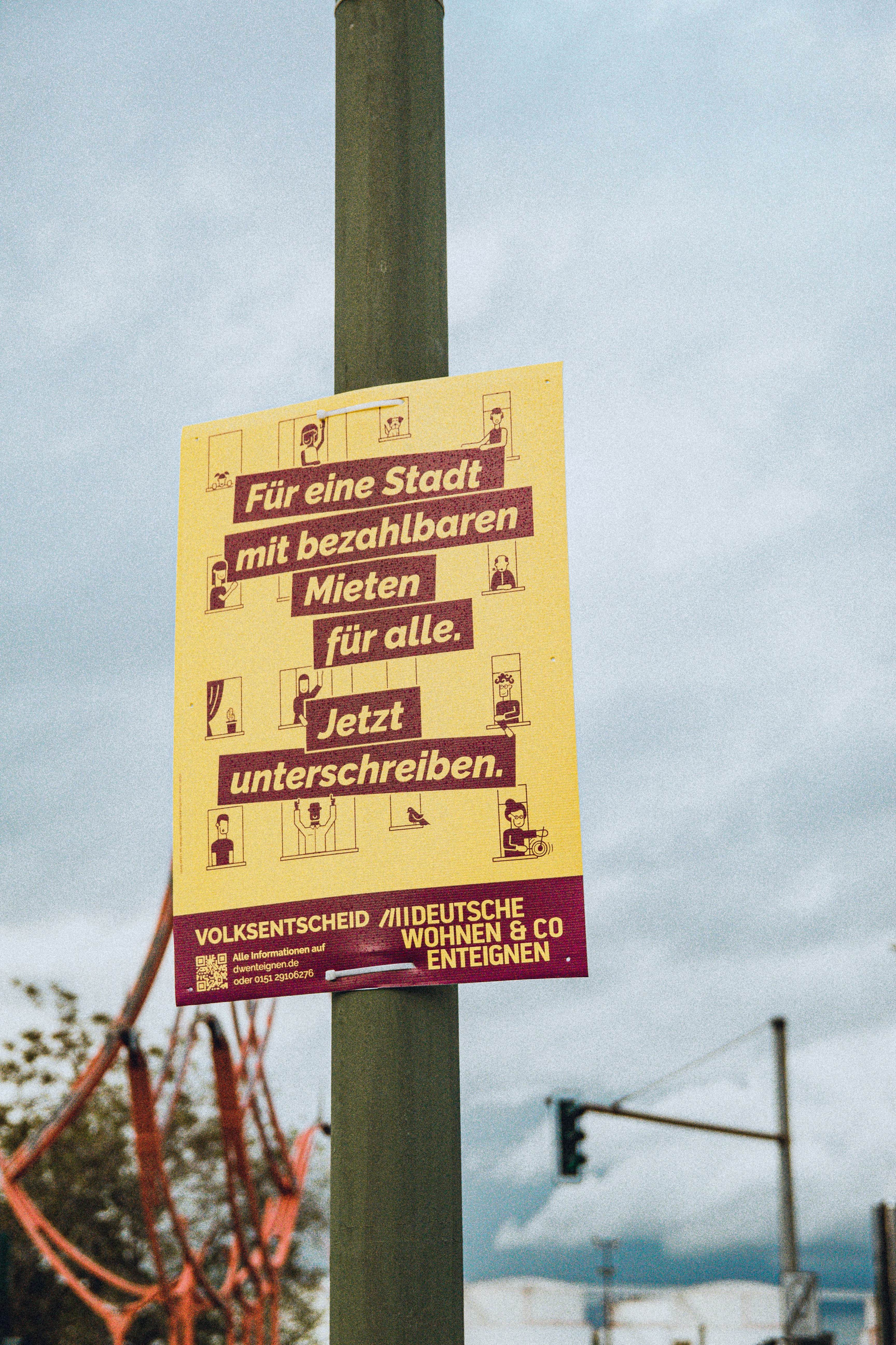 Lamppost Yellow Plea: A Quiet City Call for Affordable Housing