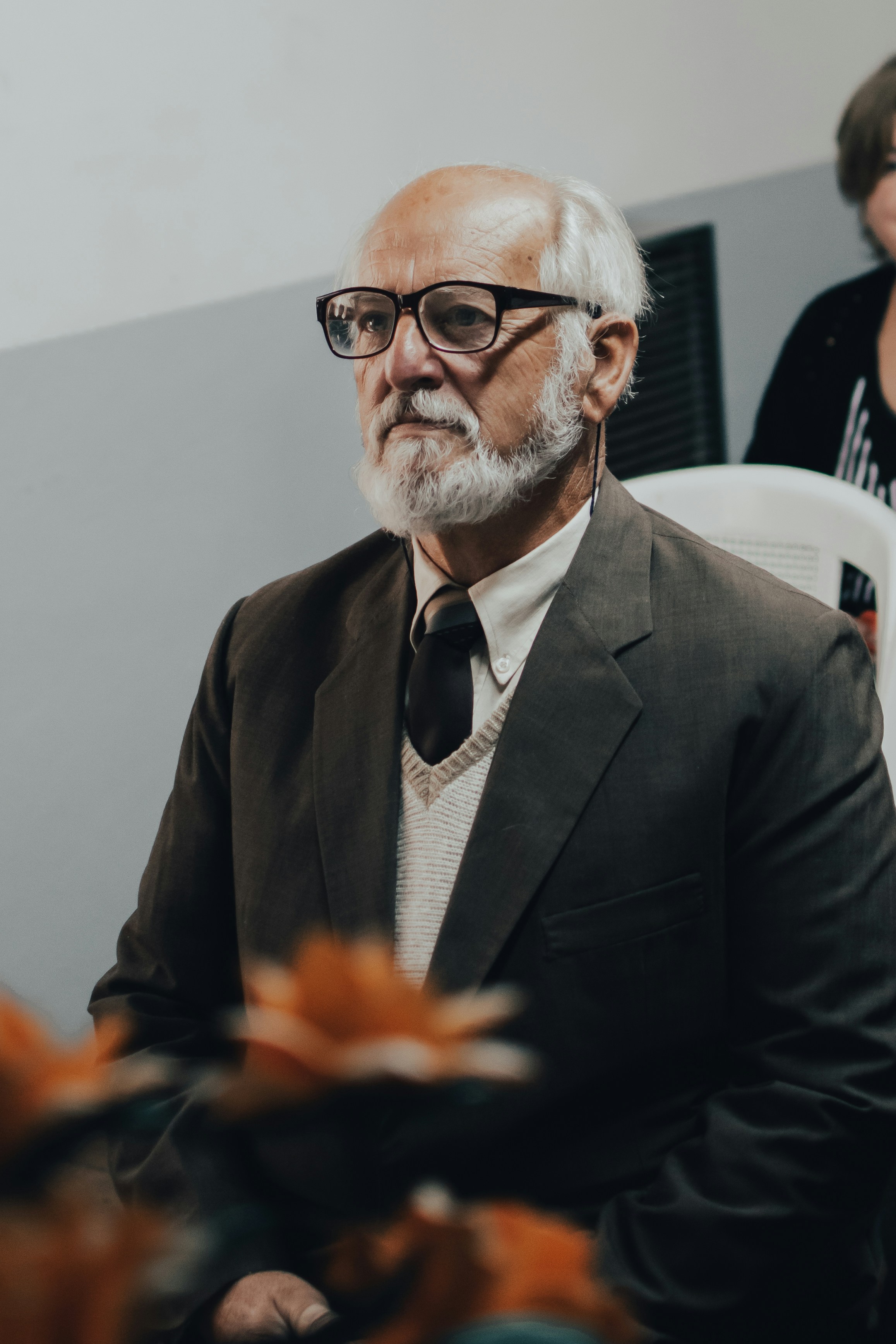 Quiet Authority: Portrait of a Distinguished Elder at a Formal Gathering