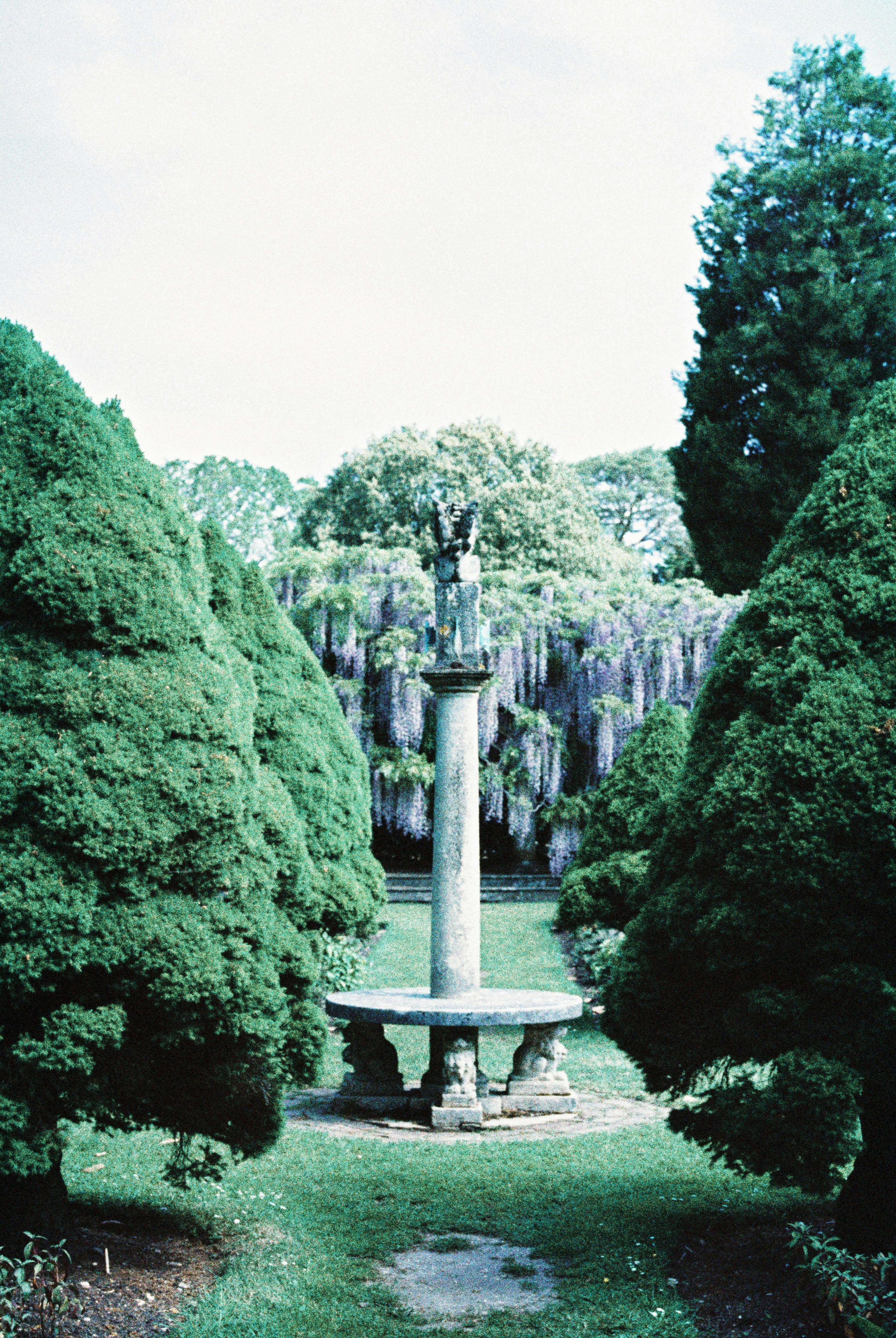 Stone Obelisk in a Symmetrical Parterre Framed by Pruned Cypresses