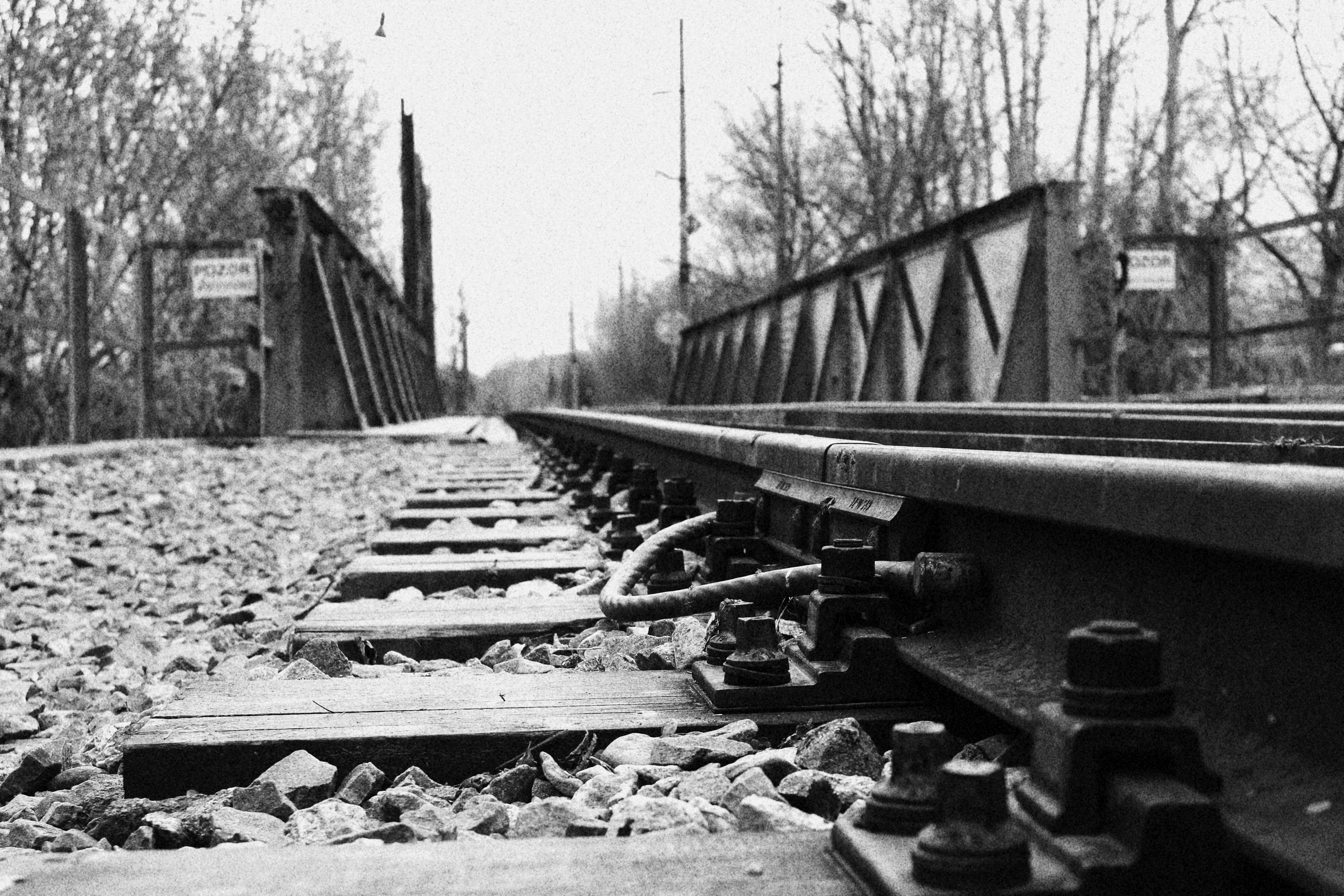 Grayscale photo of train rail photo – Free Rail Image on Unsplash