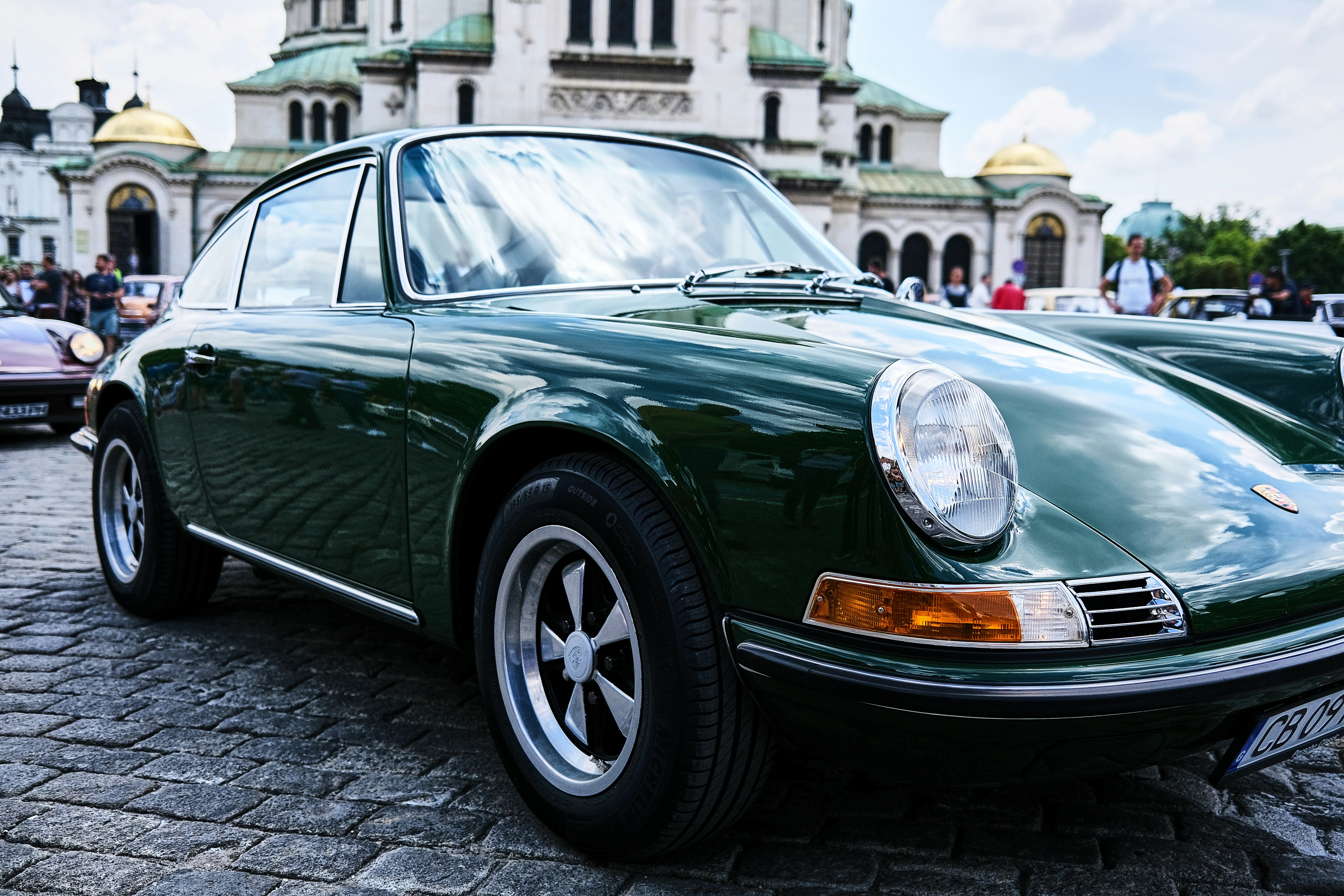 Emerald Classic: Porsche 911 on Cobblestones in a Historic Square