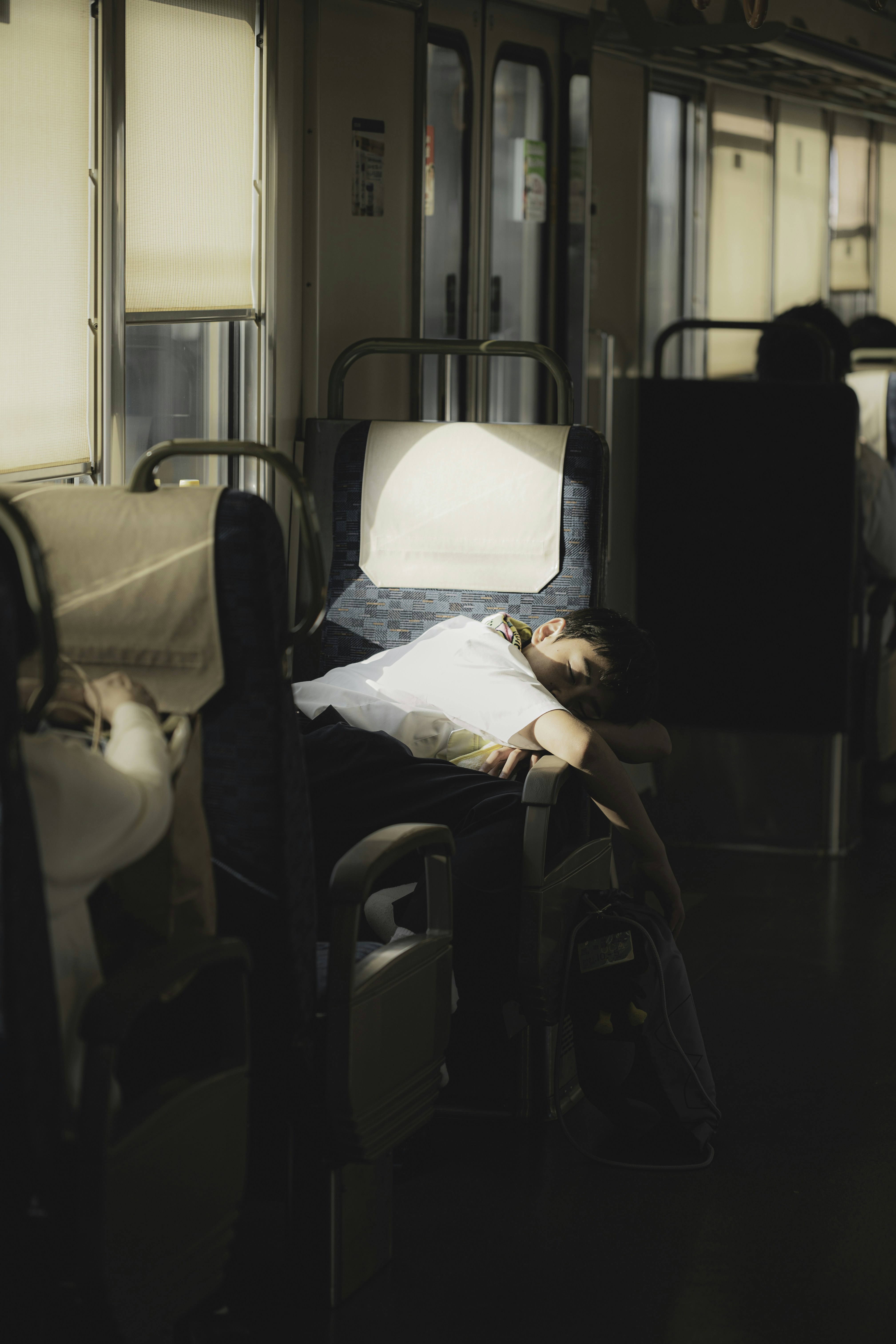 Sunlit Commuter Slumber in a Quiet Train Car