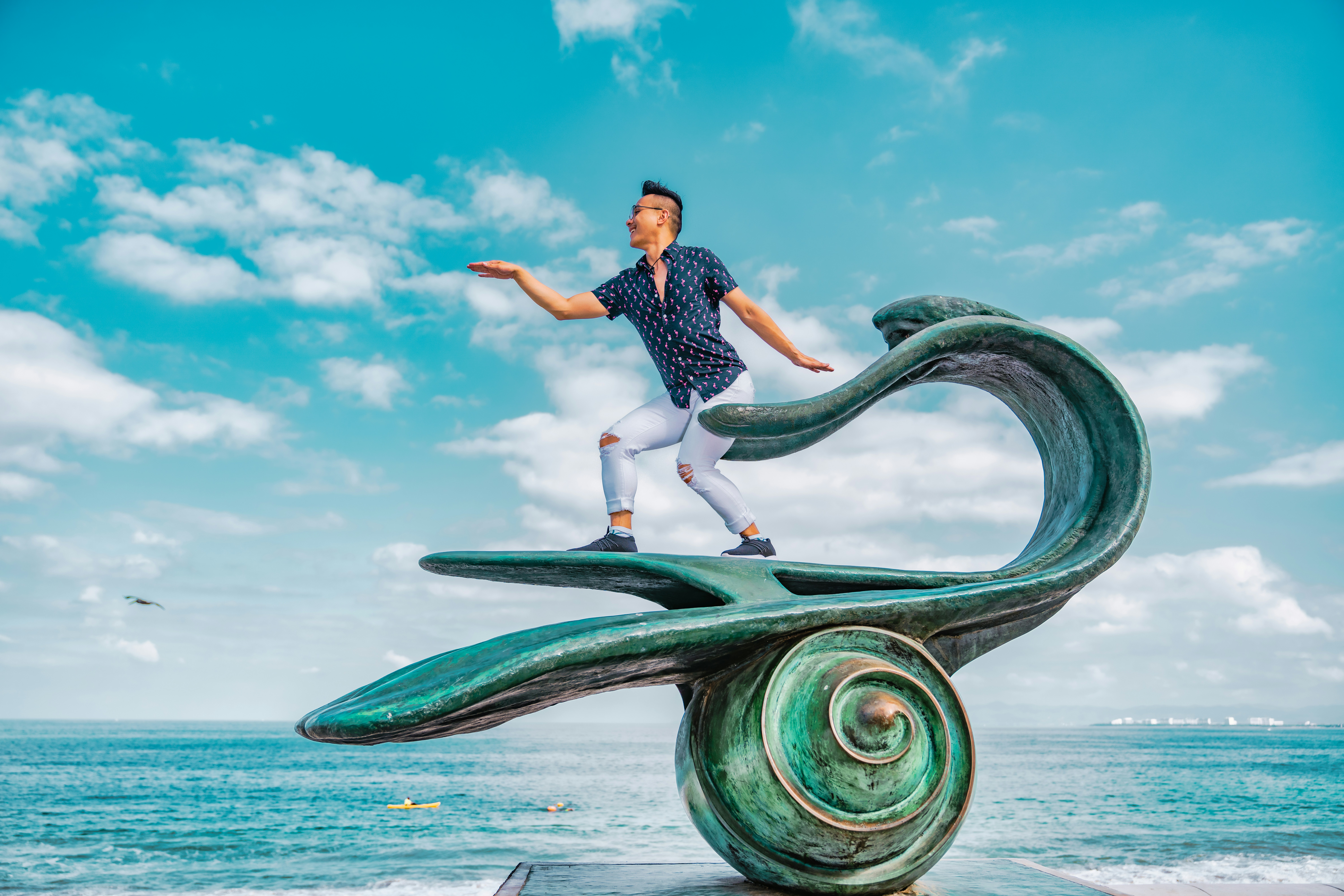 Surfing a bronce statue in Puerto Vallarta