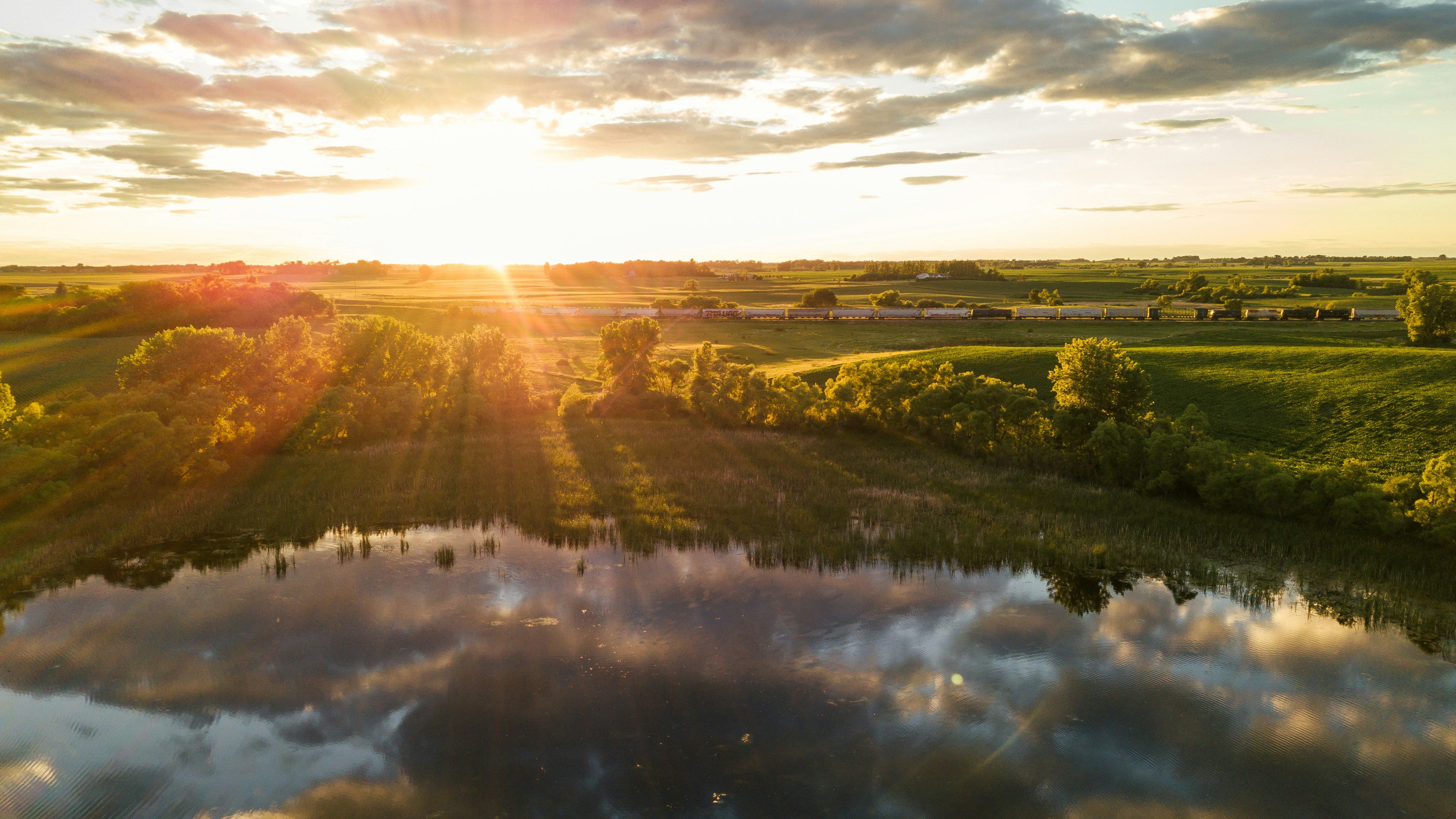 Green grass field near lake during daytime photo – Free Nature Image on ...