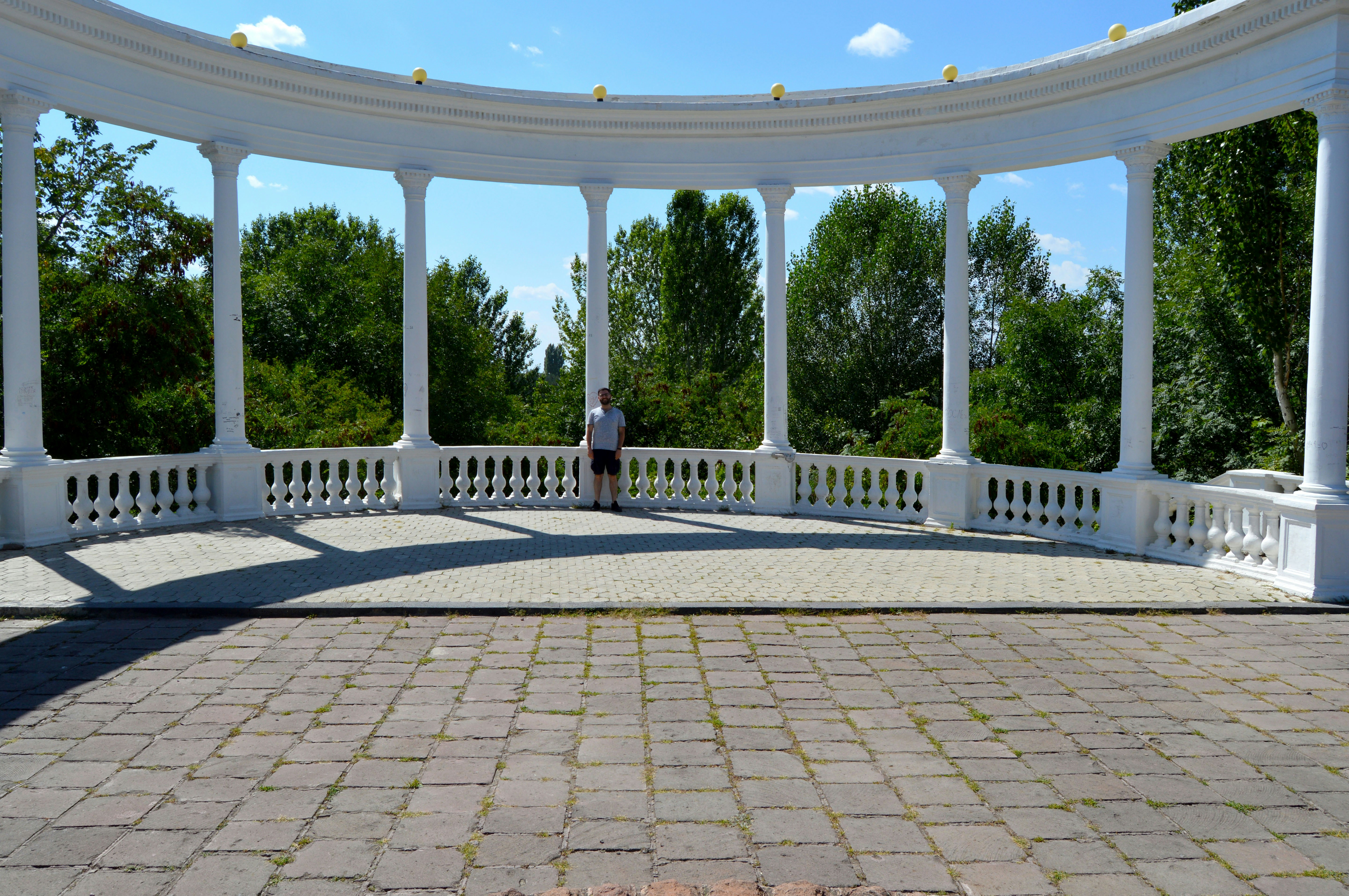 Graceful Colonnade Overlooking a Sunlit Garden