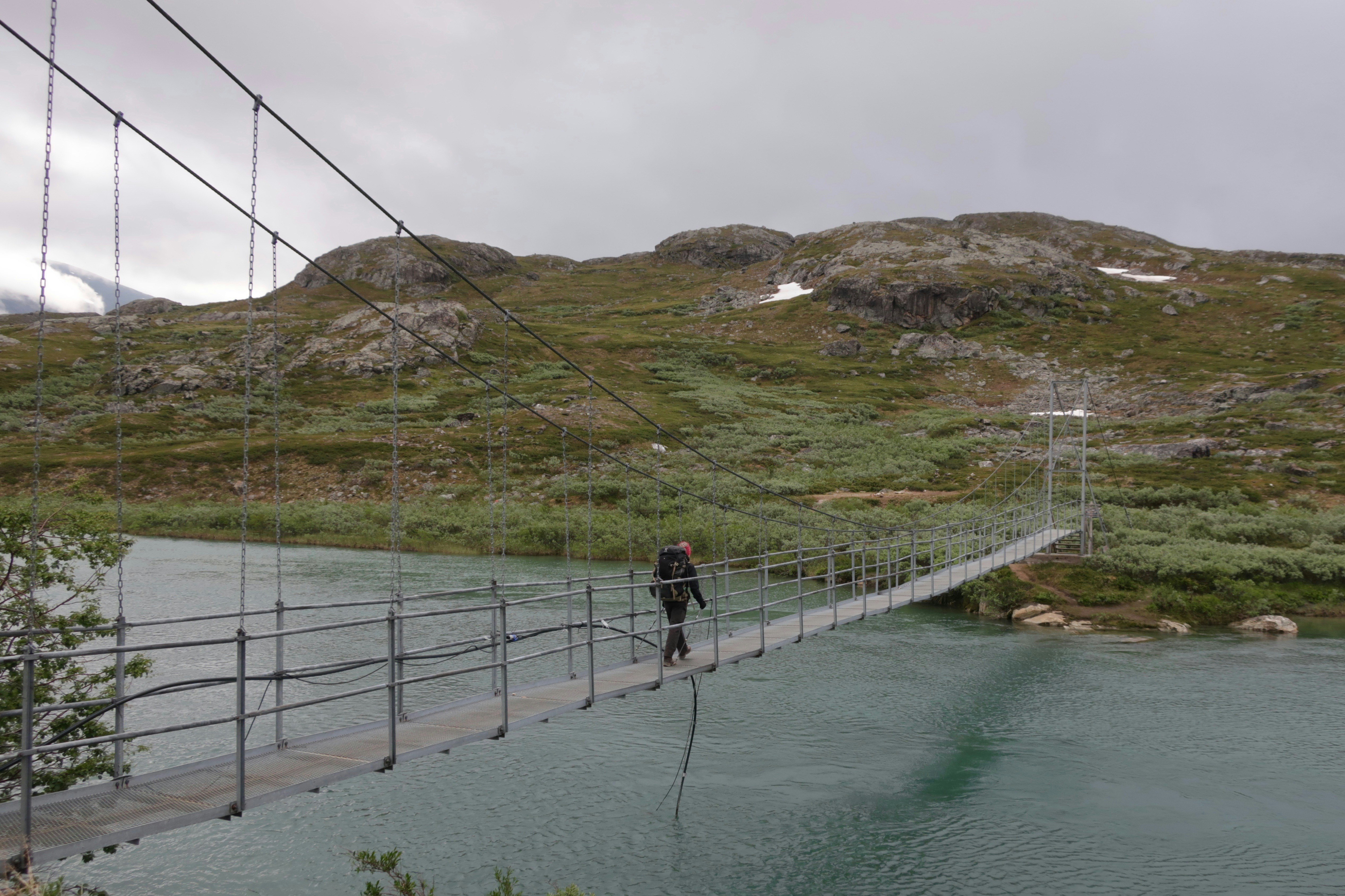 People walking on bridge over river during daytime photo – Free ...
