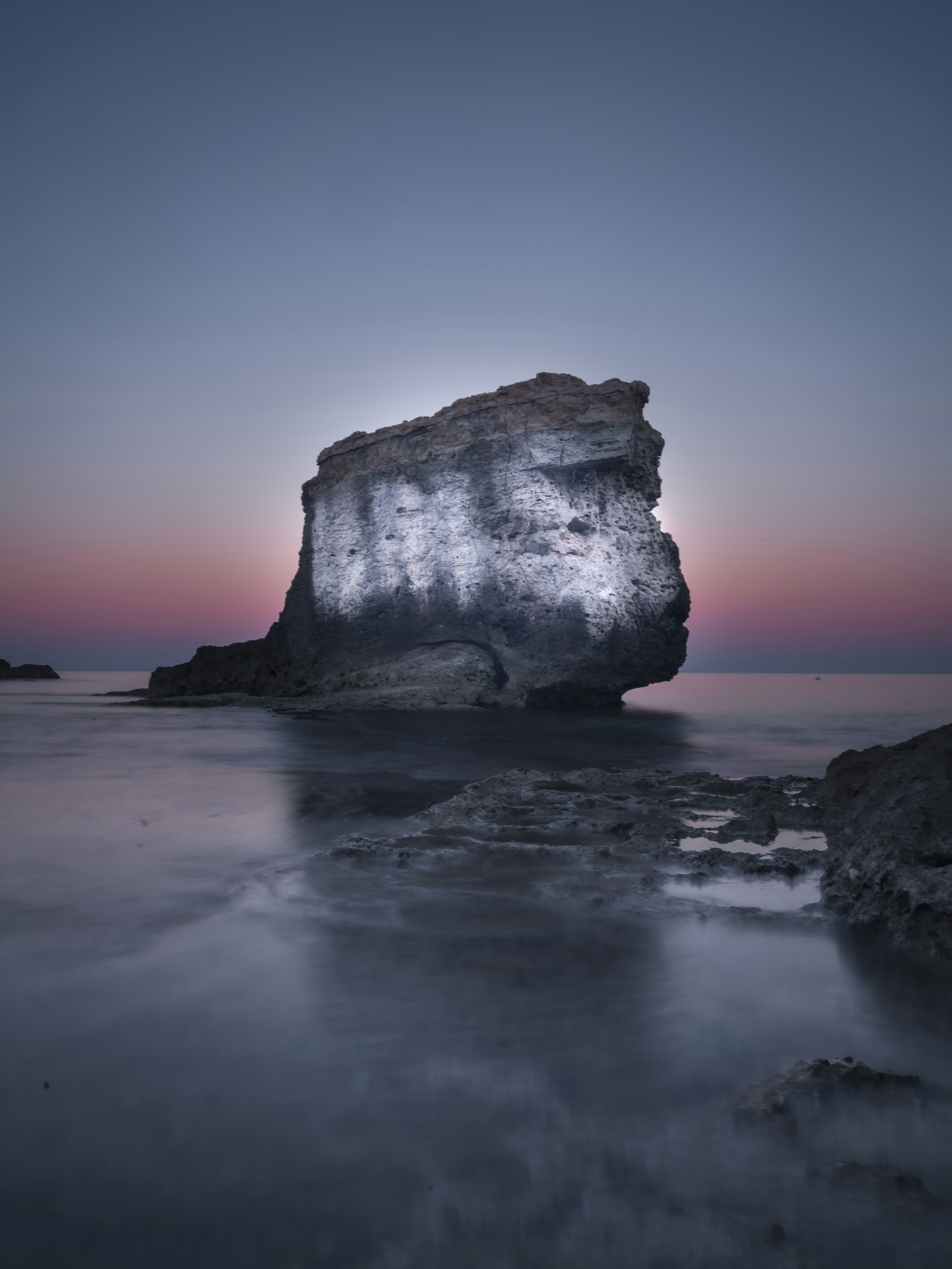 Dusk Sentinel: A Sea Stack Standing Against a Velvet Horizon