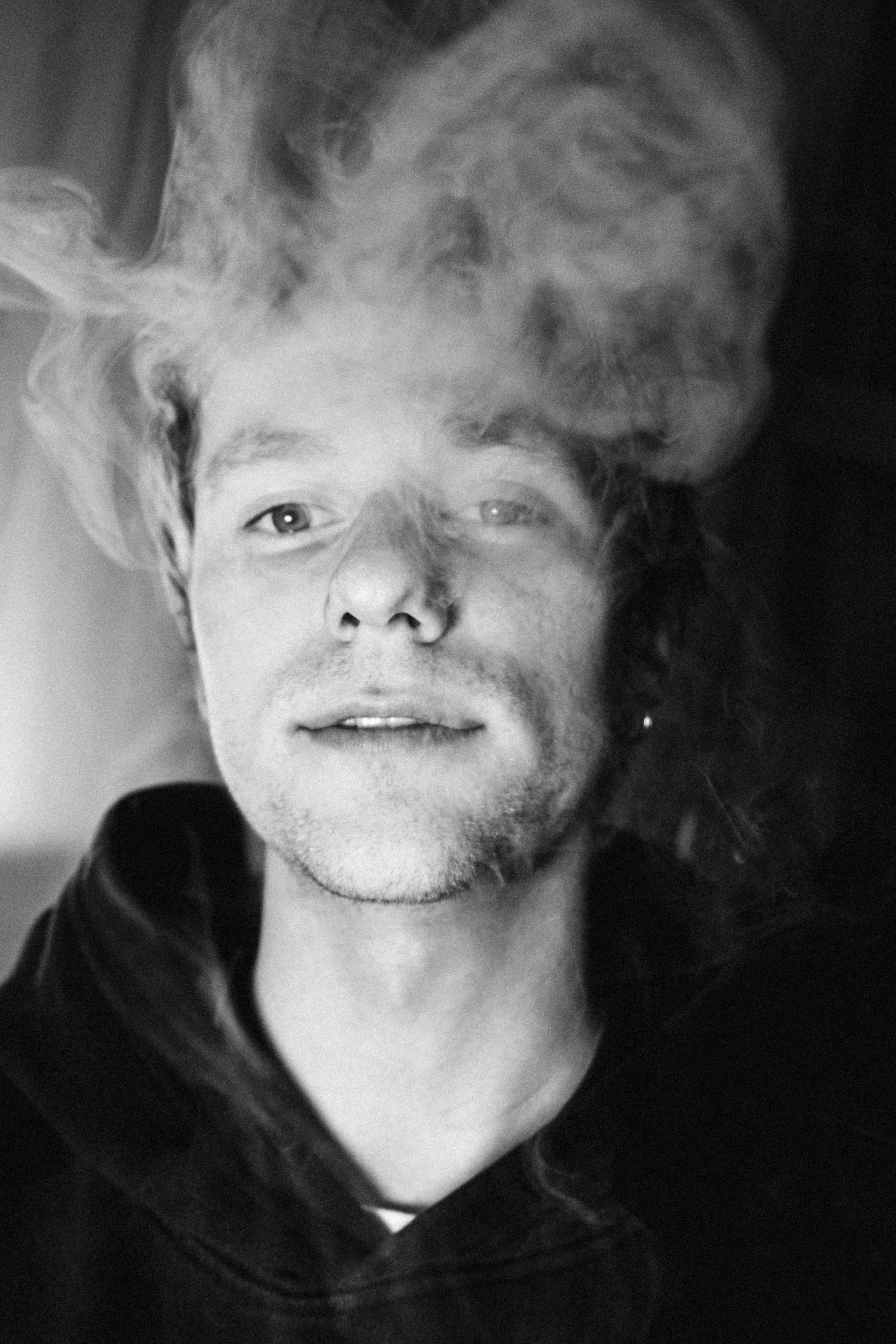 Monochrome Portrait: Smoke Framing a Quiet Gaze