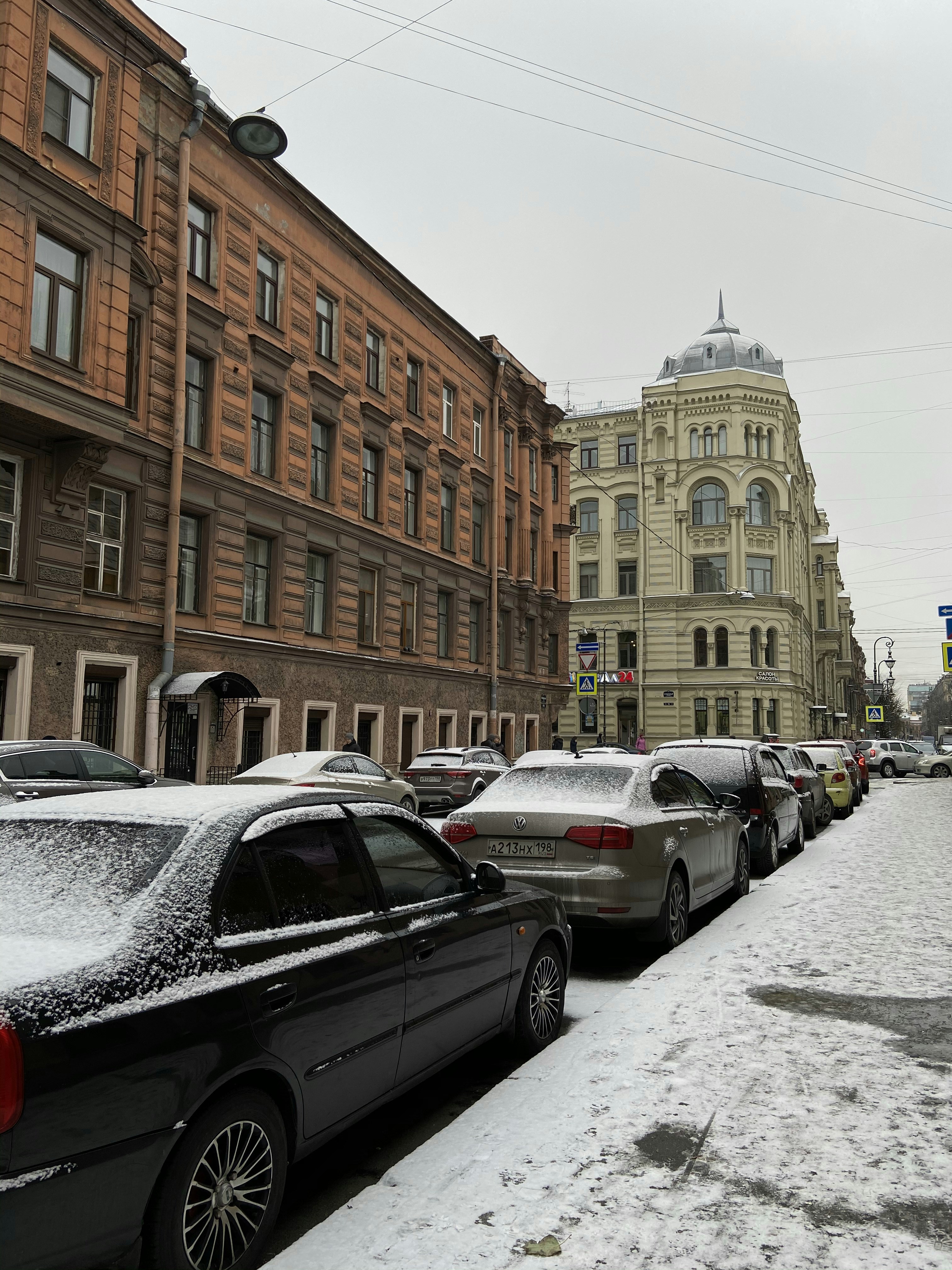 Snow-Covered Street Toward a Domed European Corner Tower