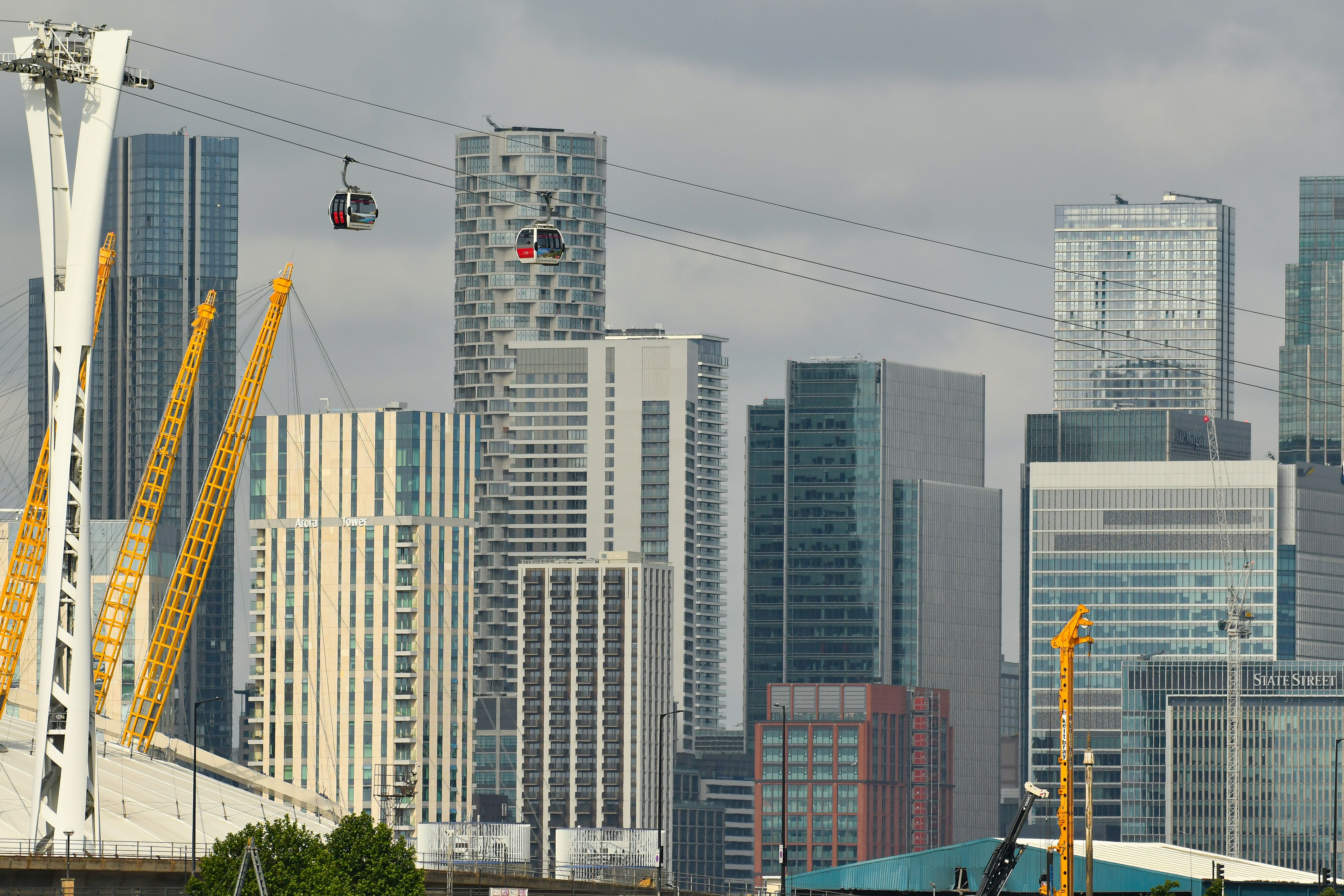 Cable Cars Glide Across a Glassy Downtown Skyline