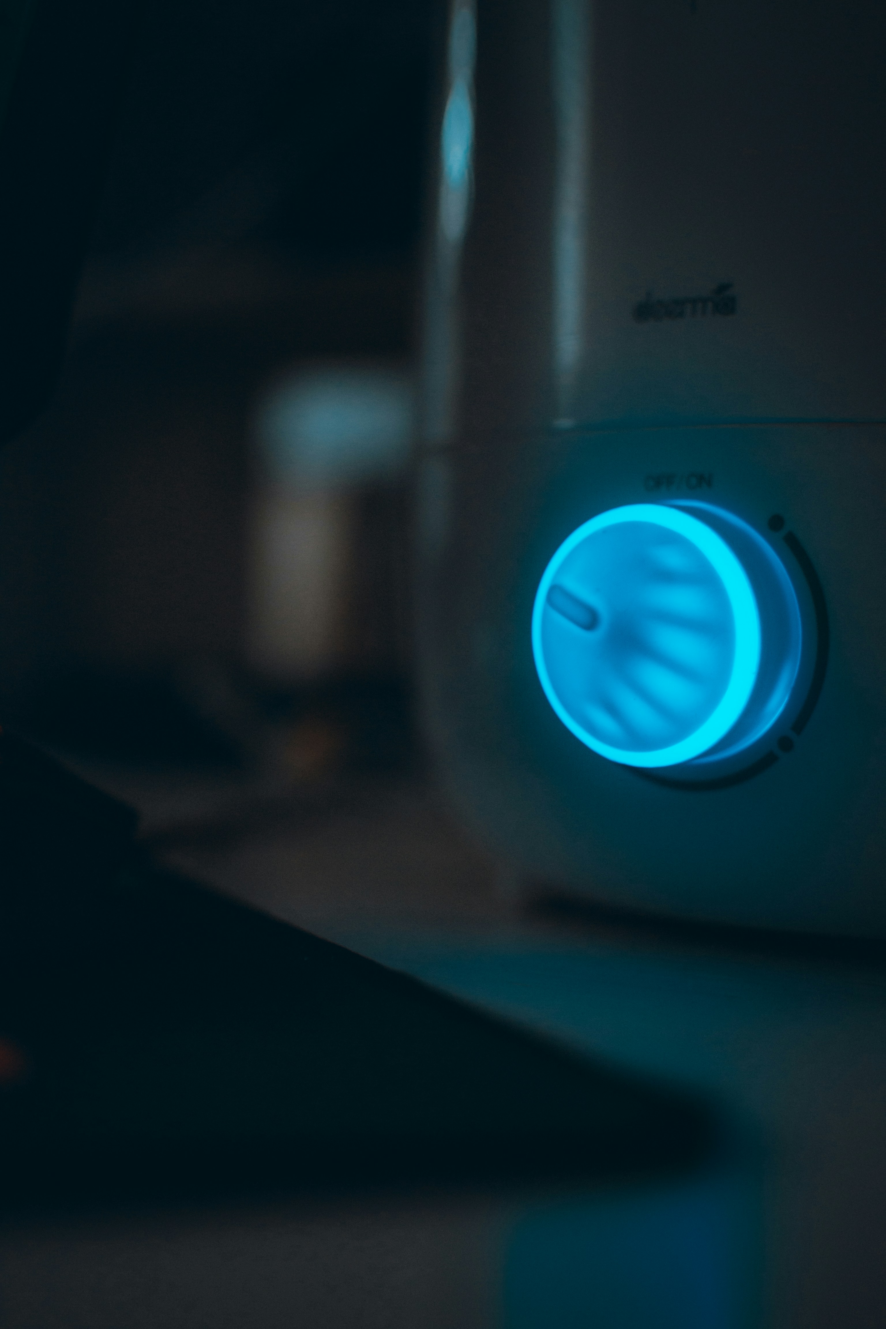 Blue Neon Dial: A Close-Up of a Glowing Power Knob