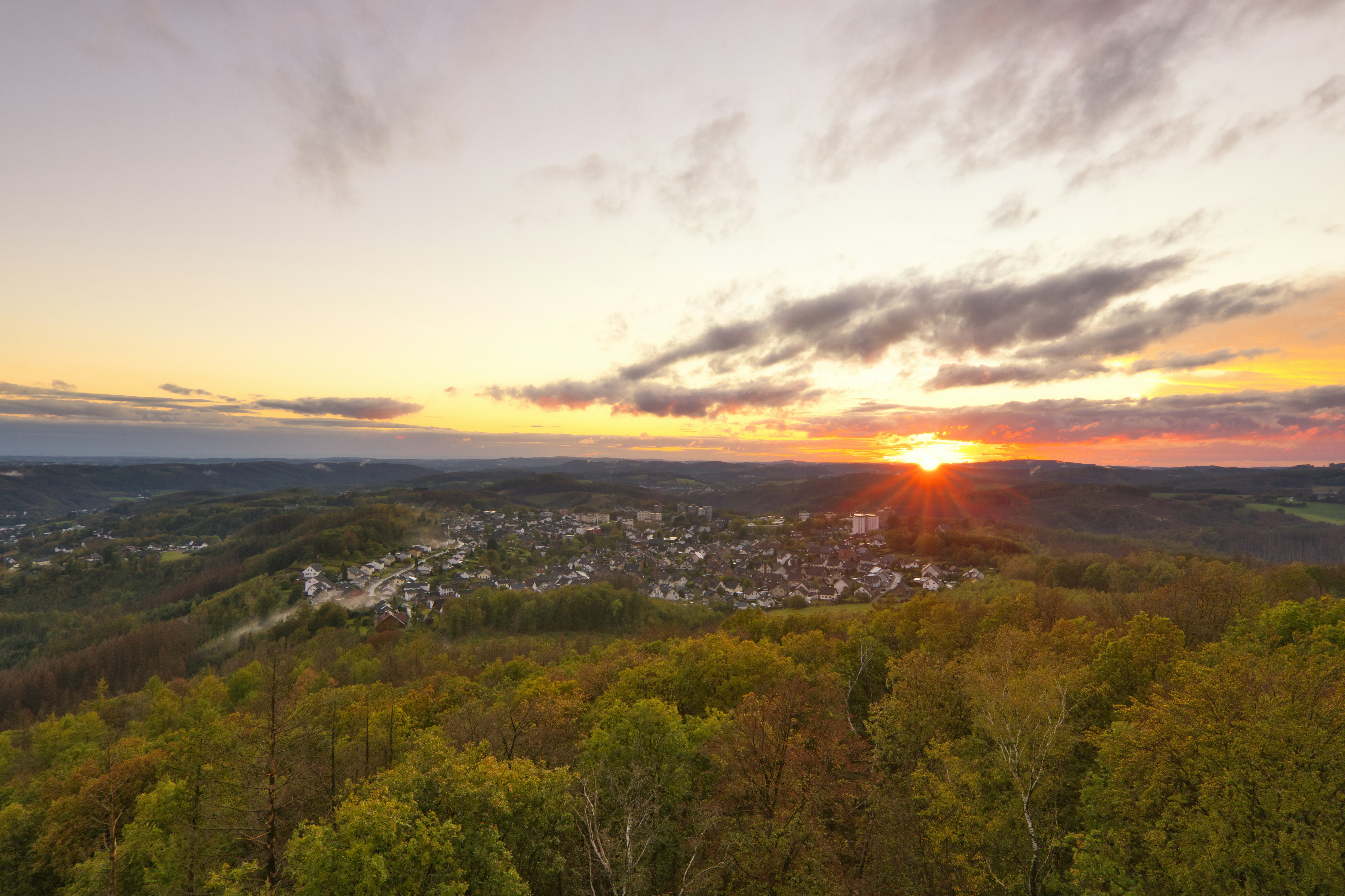 Sunset Symphony Over Verdant Hills