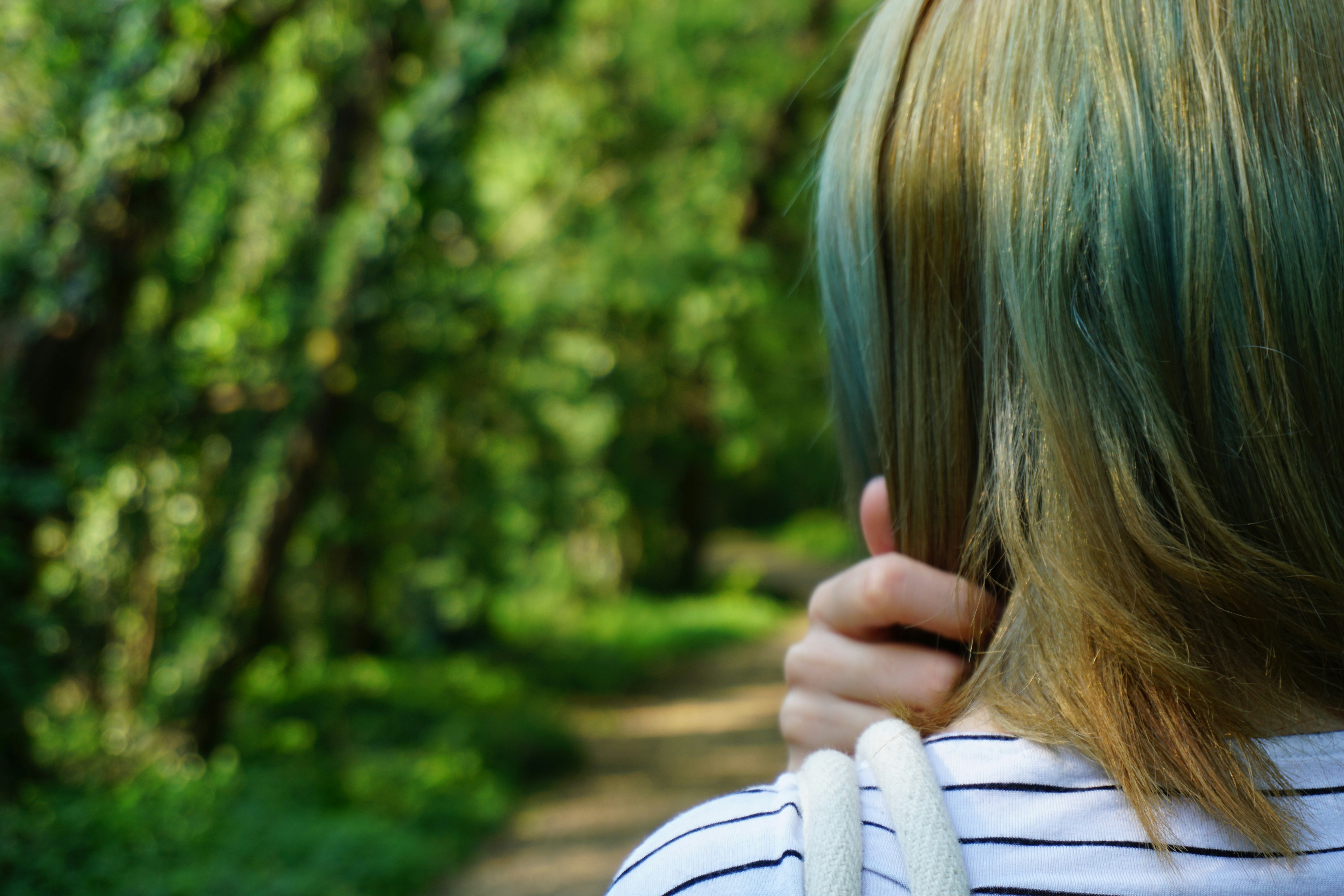 Back View on a Forest Path: Portrait in Dappled Green Light