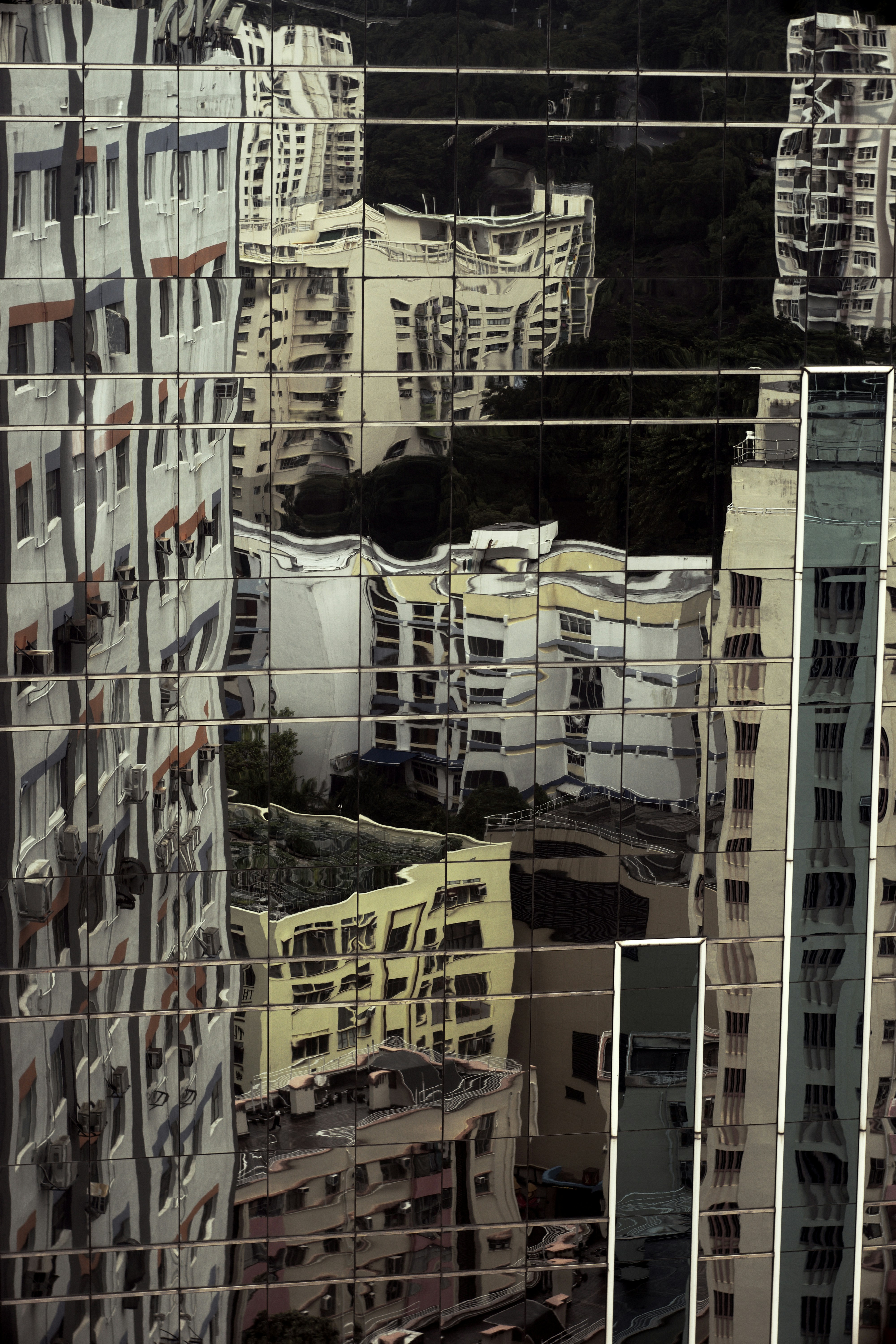 Wavy Glass Mosaic: A City Reflected in a Grid of Windows