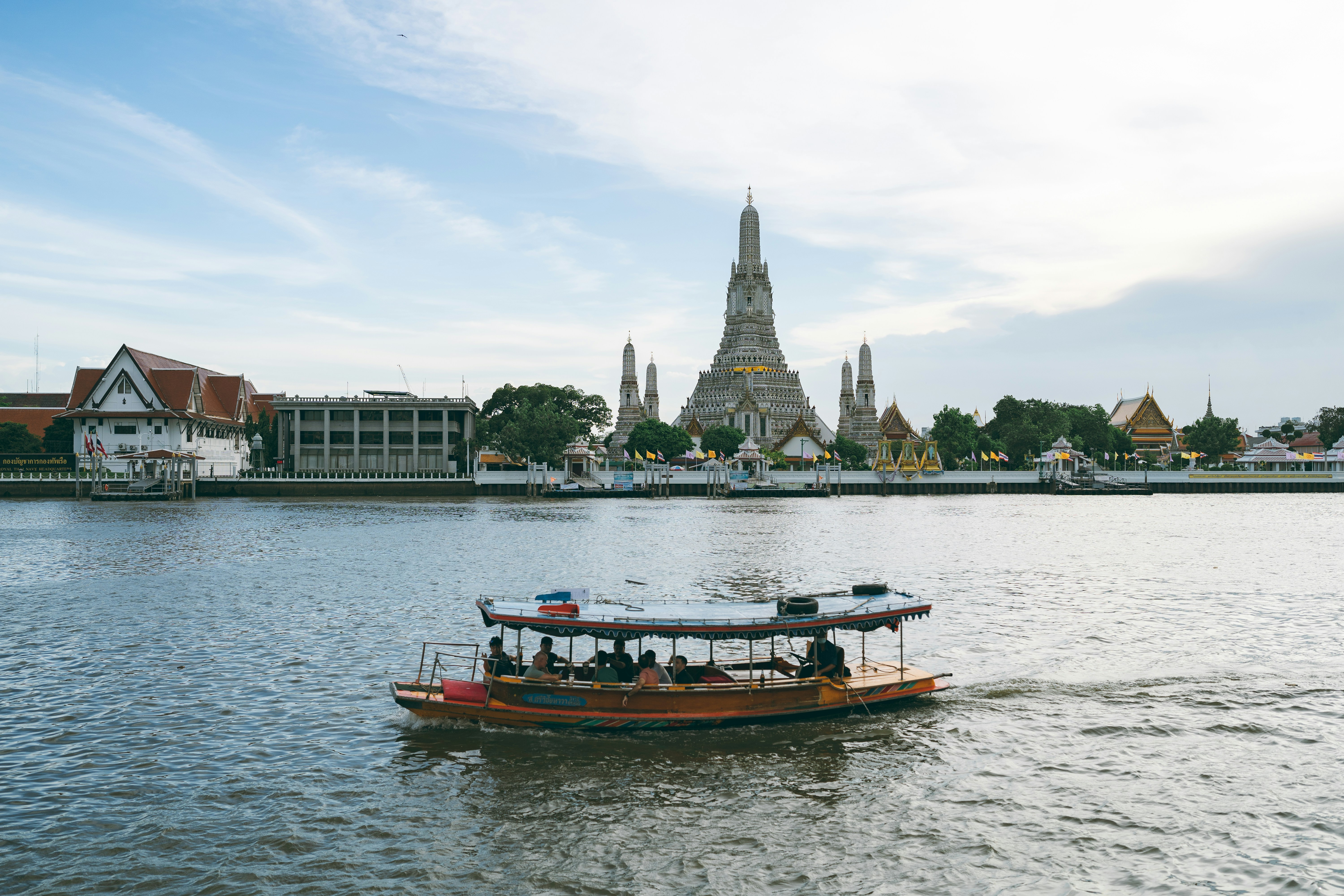 Wat Arun's Spire Over the River: a Bangkok Moment with a Riverside Boat