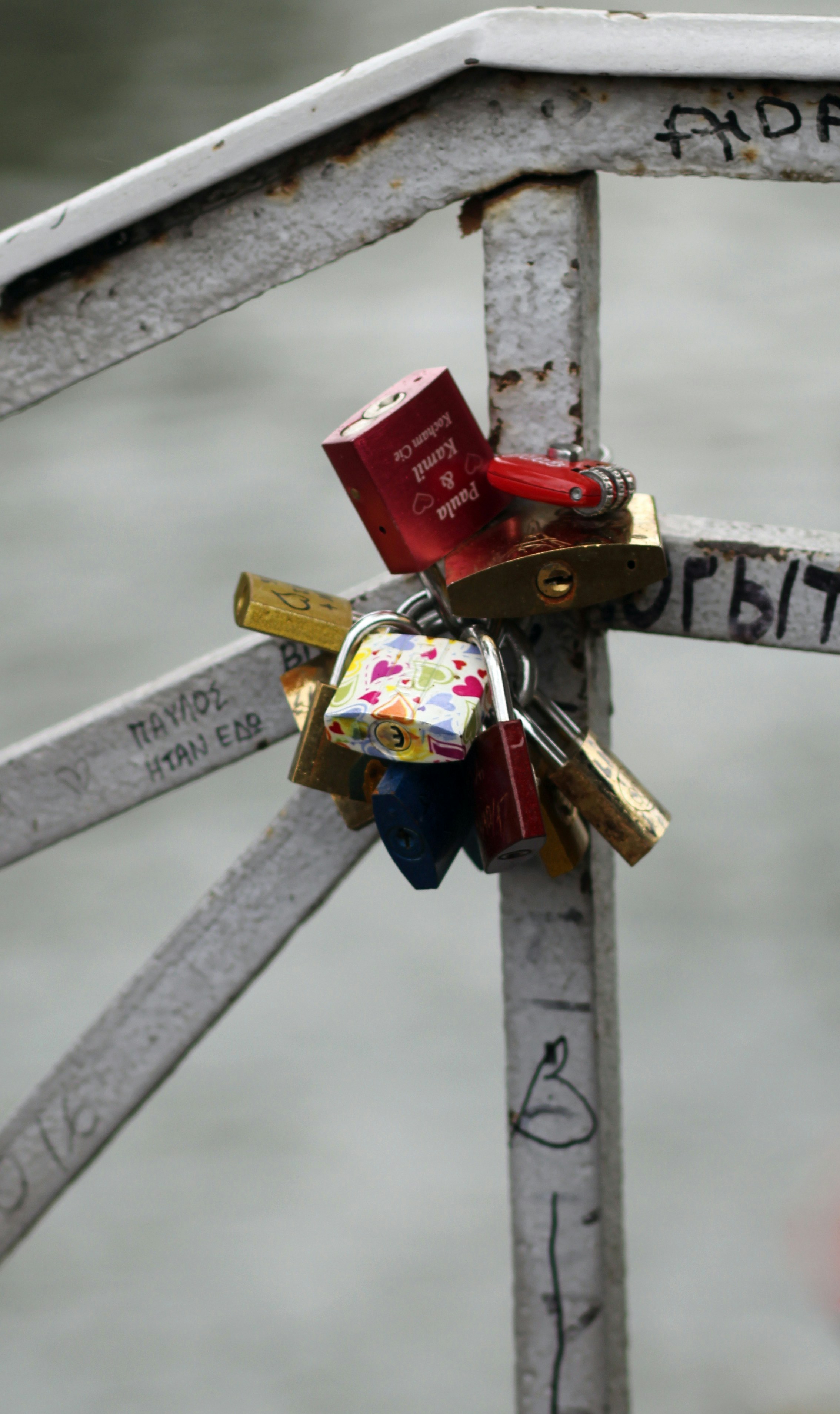 Red and silver padlock on gray metal bar photo – Free Outdoors Image on ...