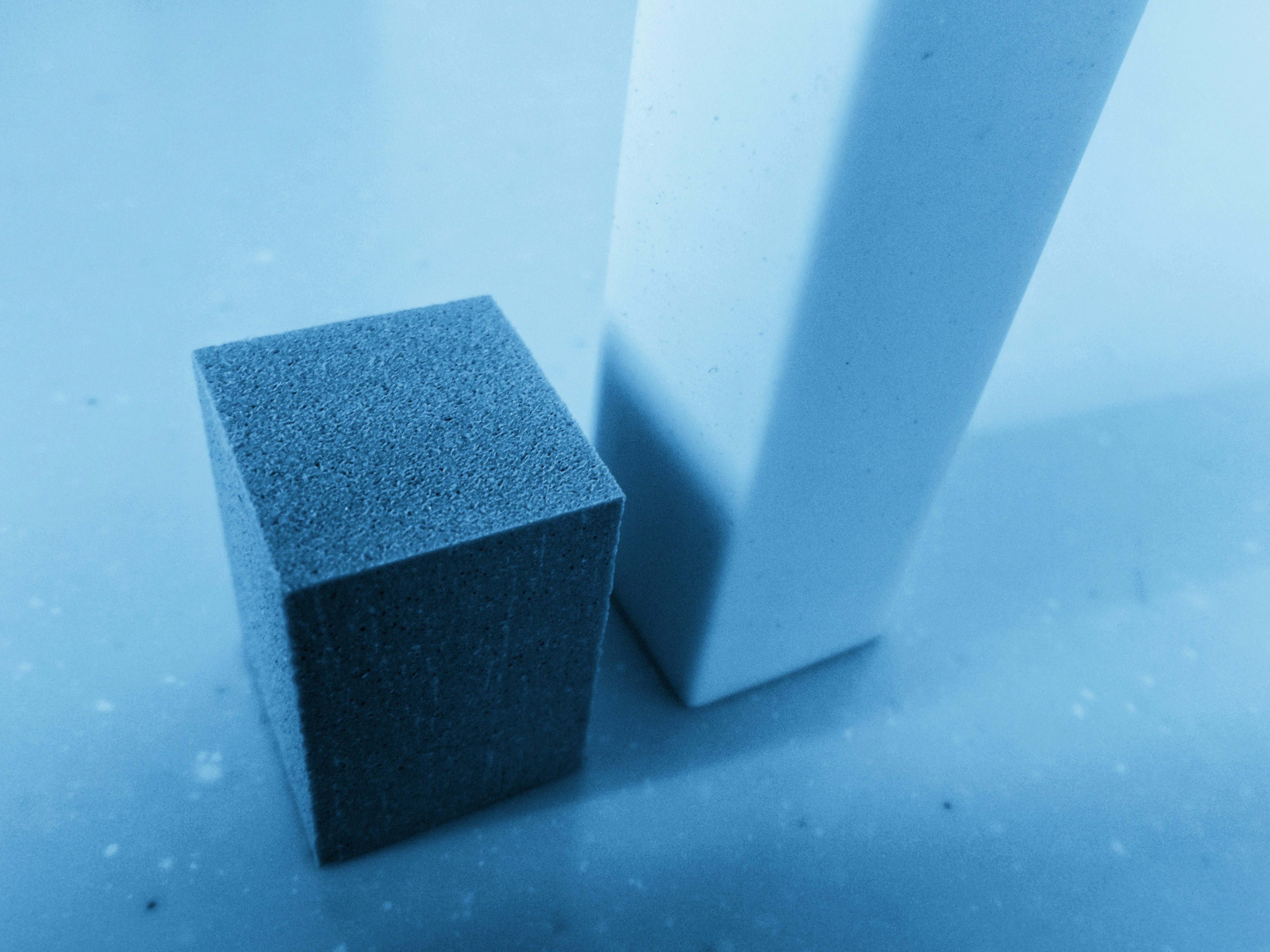 2 white square blocks on teal surface photo – Free Image on Unsplash