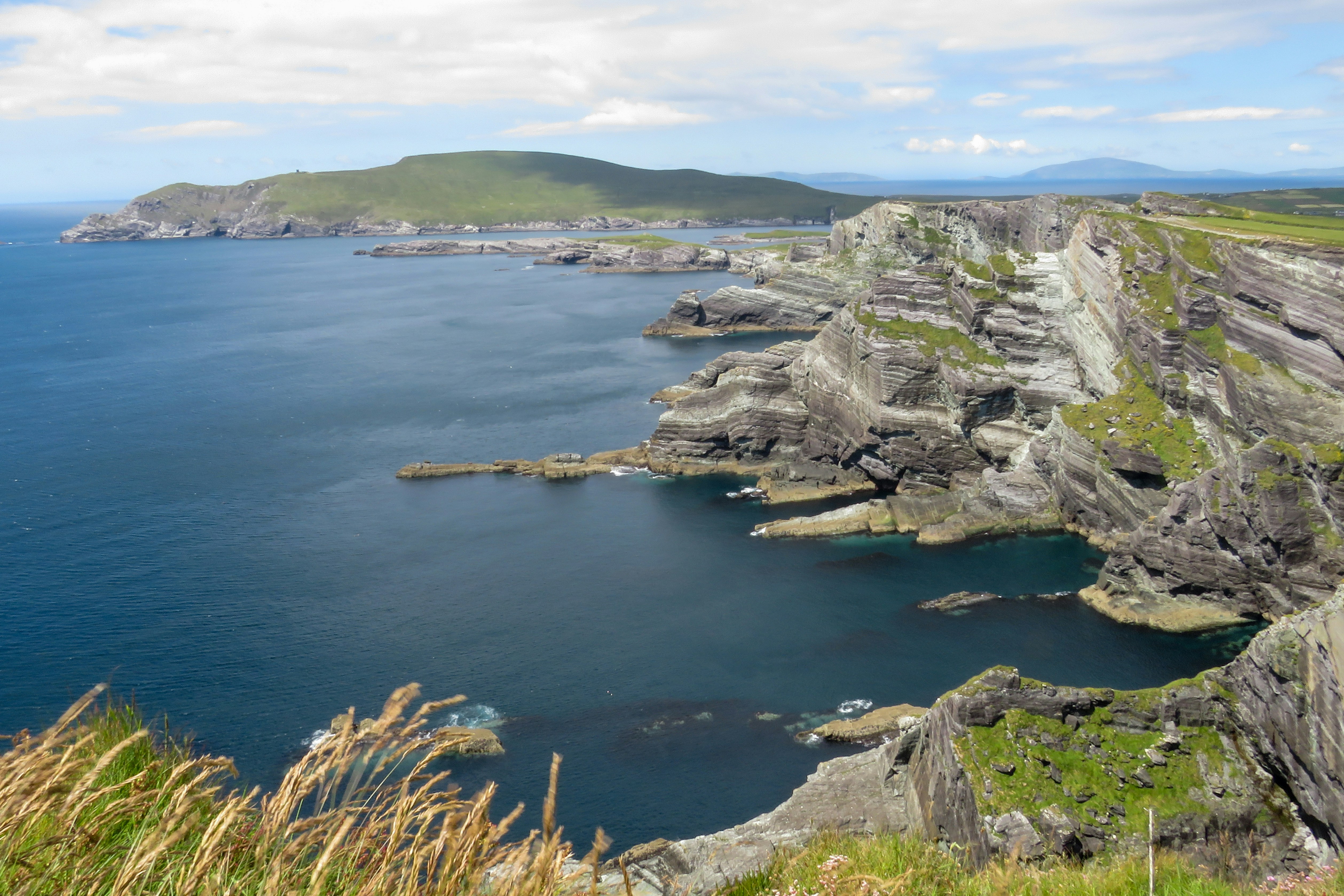 Gray rocky mountain beside blue sea during daytime photo – Free ...