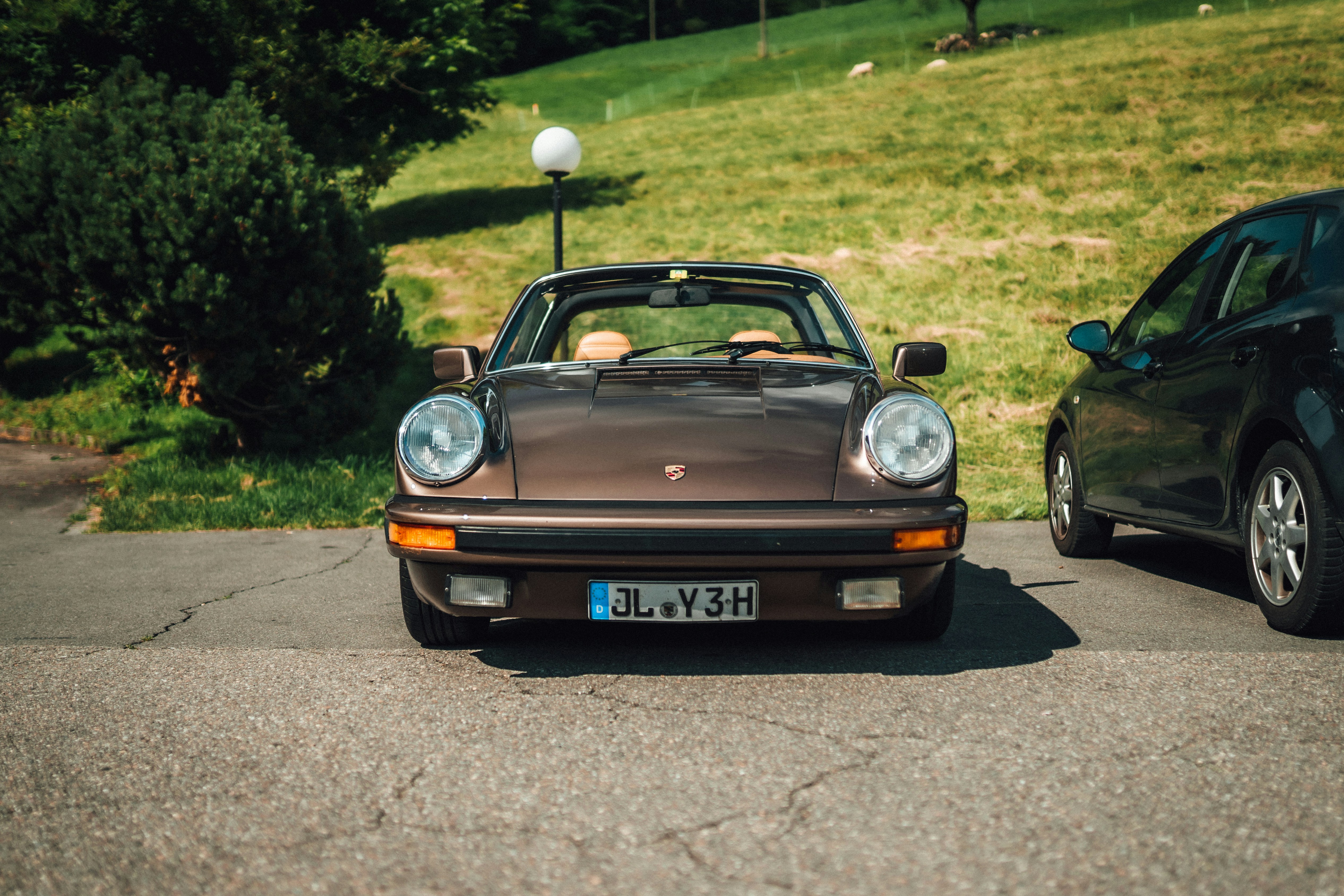 Brown porsche 911 on road during daytime photo – Free Car Image on Unsplash