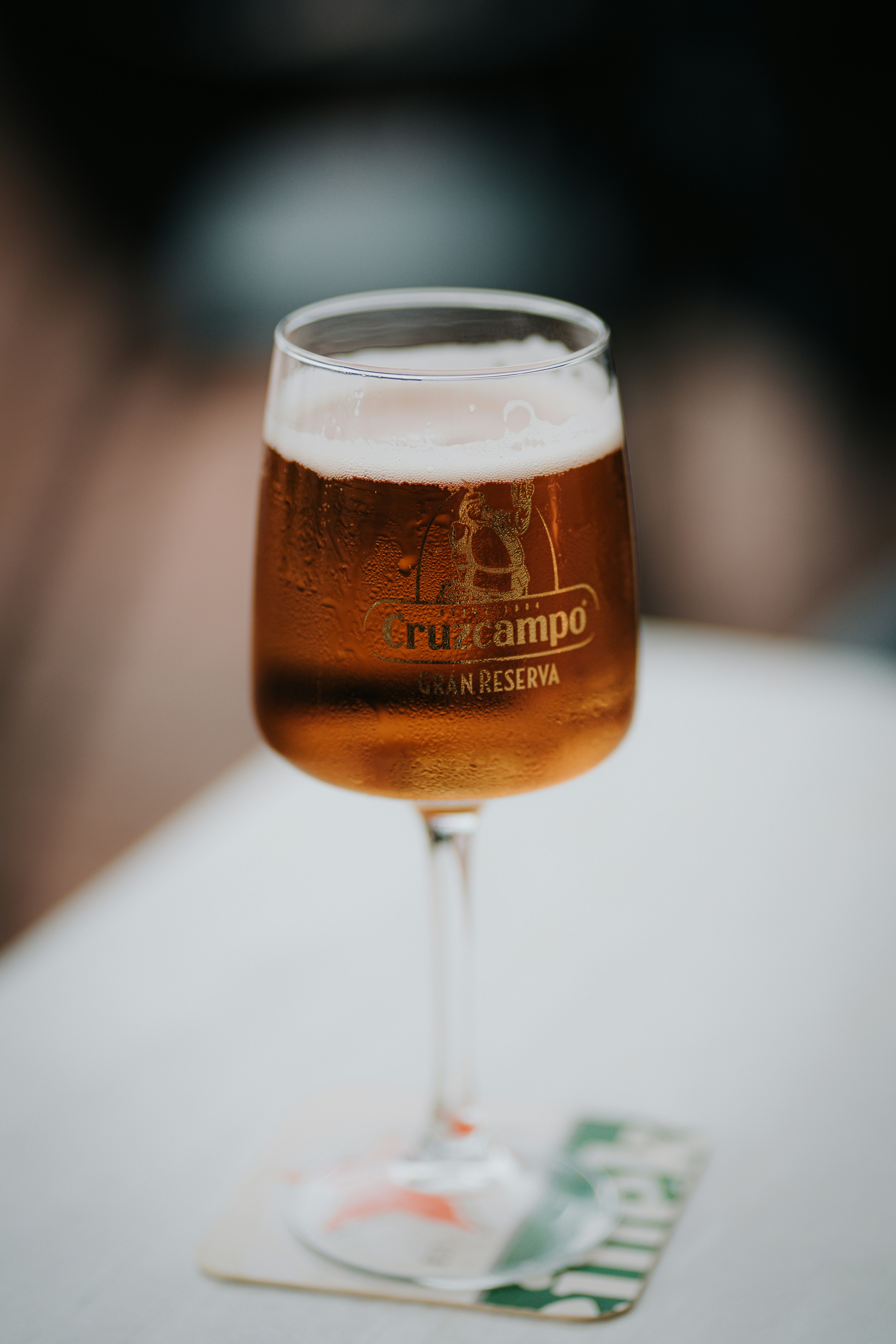 Amber Focus: Cruzcampo Glass on a Quiet Table