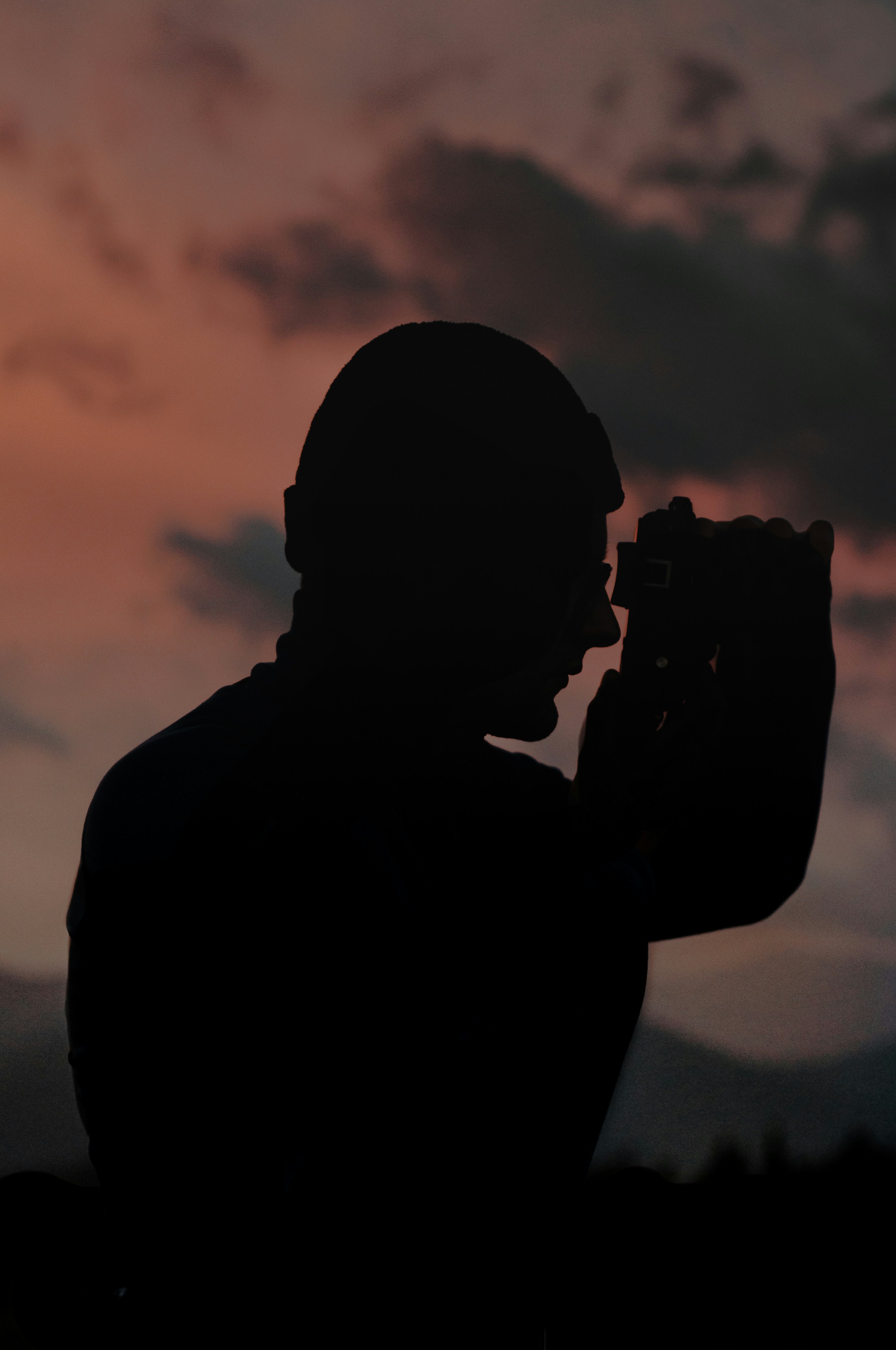 Twilight Silhouette: A Photographer Framing the Sunset