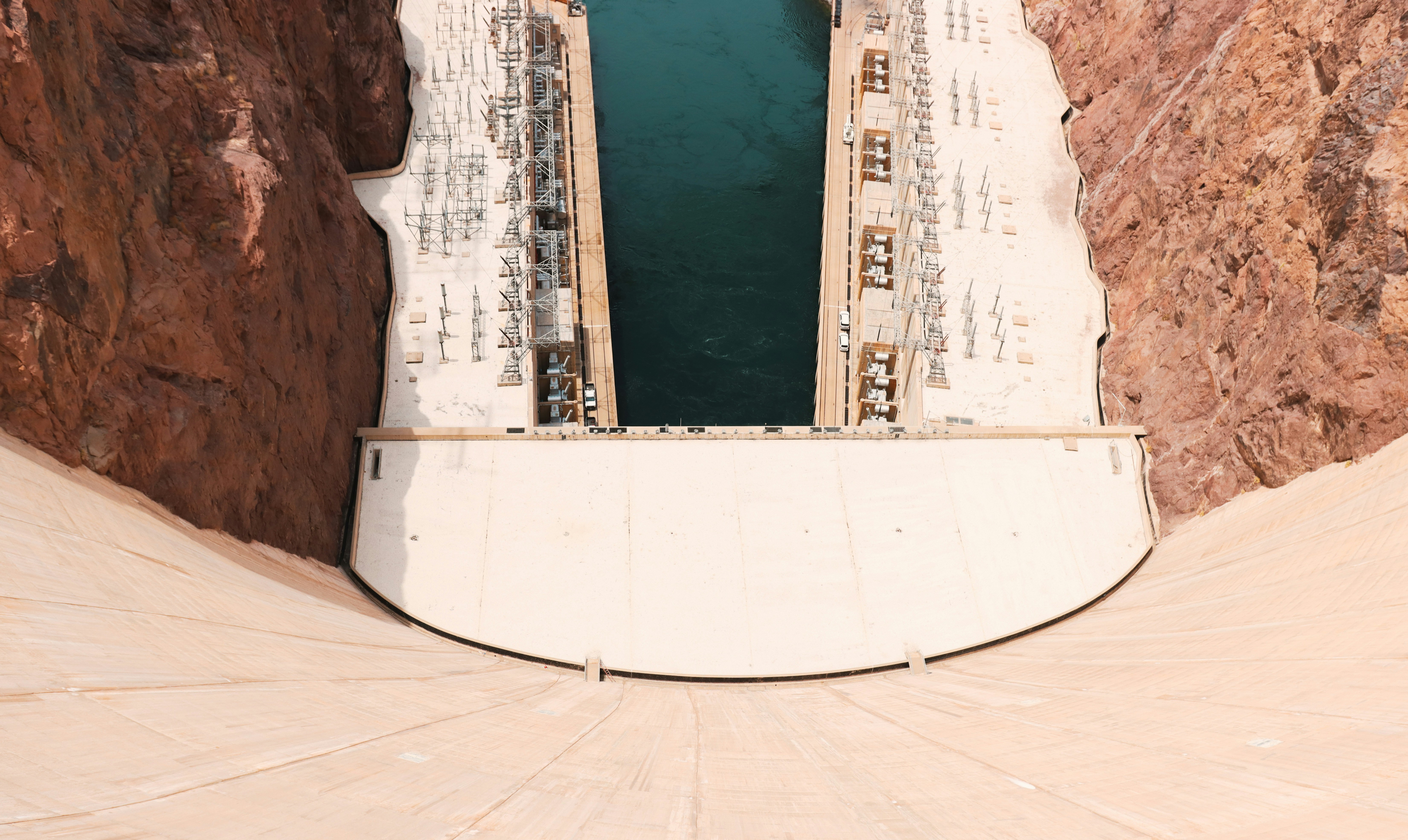 Edge of the Gorge: Turquoise Spillway Framed by Rust and White