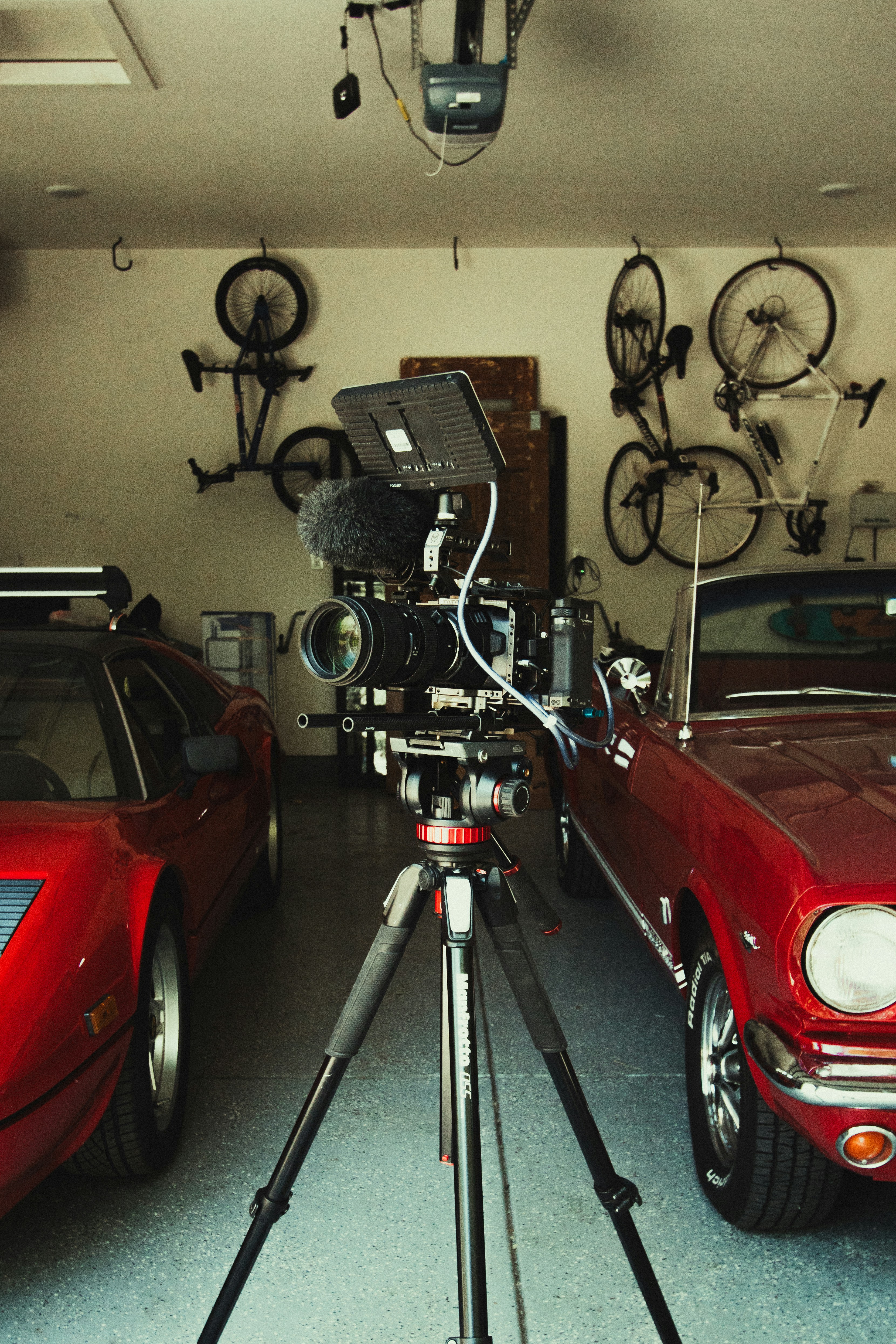 Studio Setup: A Canon EOS 90D Framed by Vintage Cars in a Bicycle-Heavy Garage