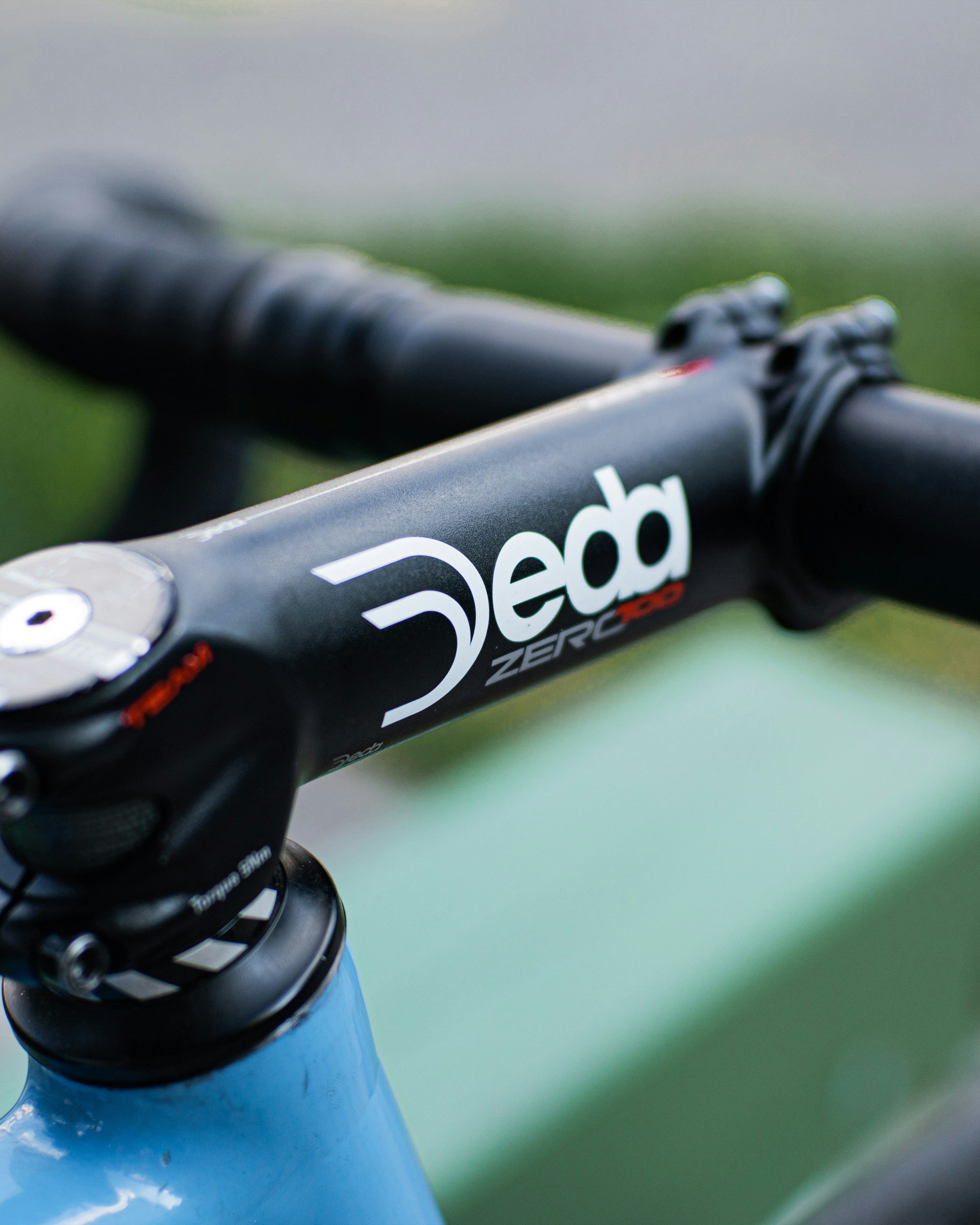 Brand Emblem on the Bar: a macro close-up of a bicycle stem