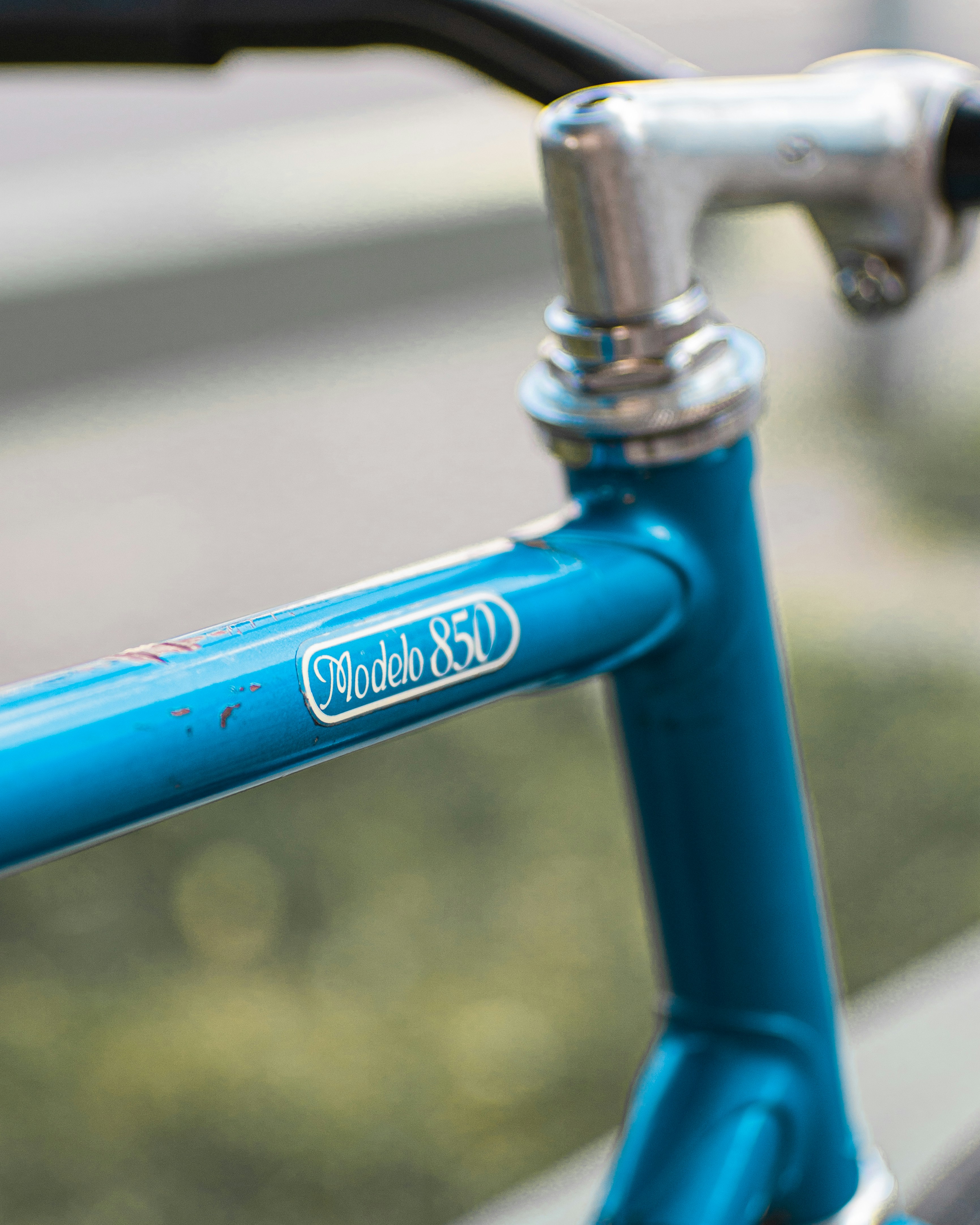 Modelo 851 Badge on a Weathered Blue Bicycle Frame