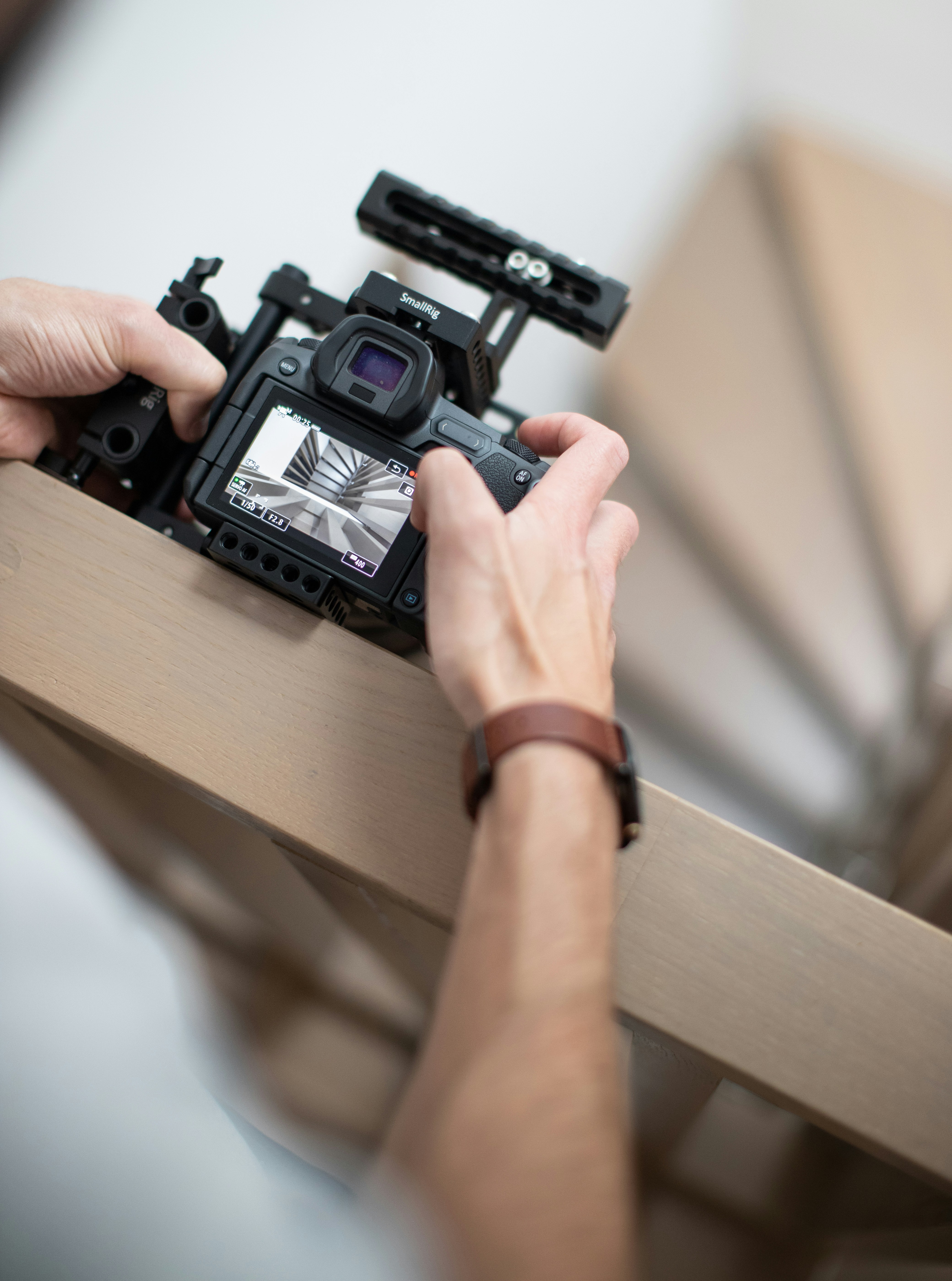 Handheld Precision: A DSLR Operator Attains a Steady Framing