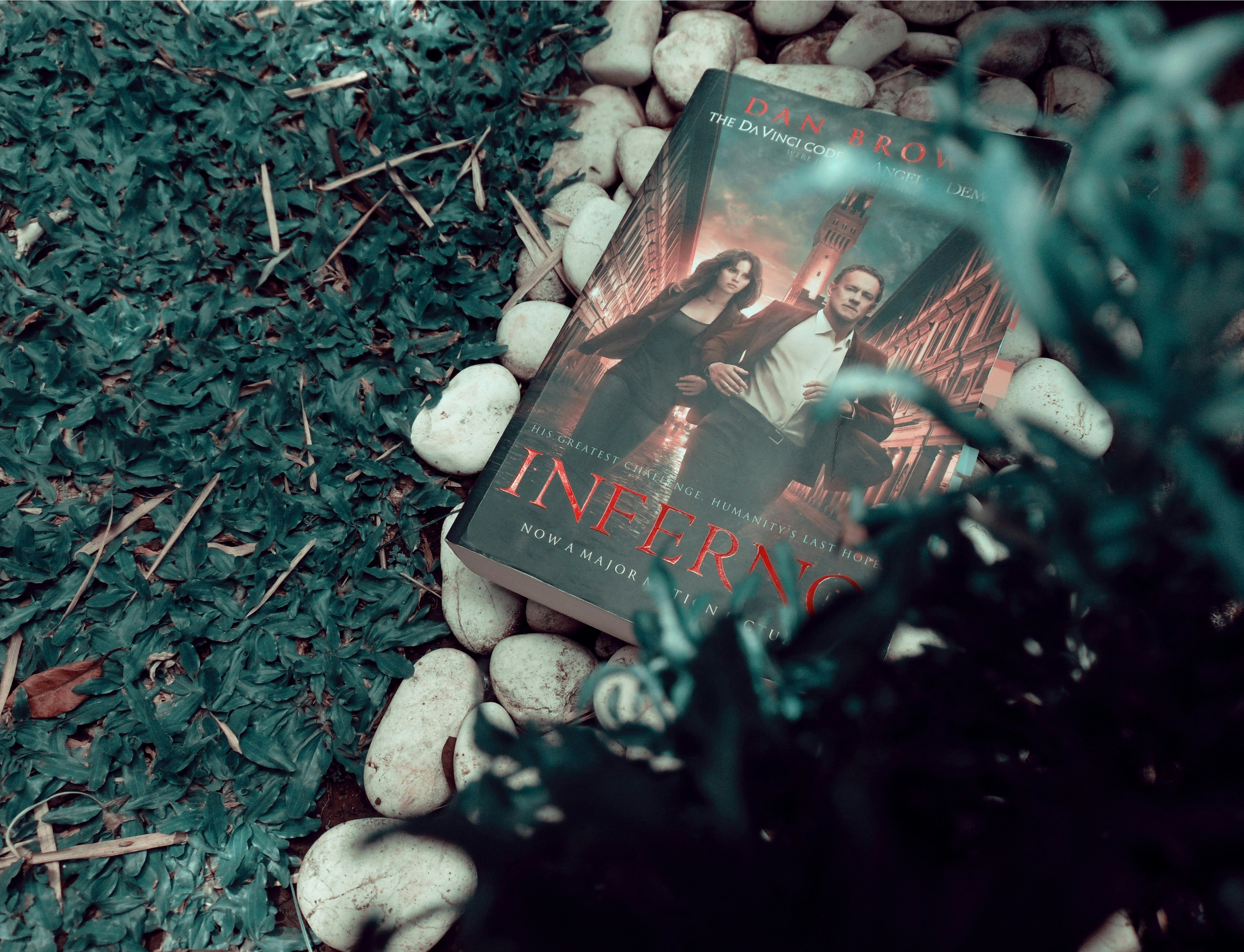 Inferno - Dan Brown | a book sitting on top of a pile of rocks