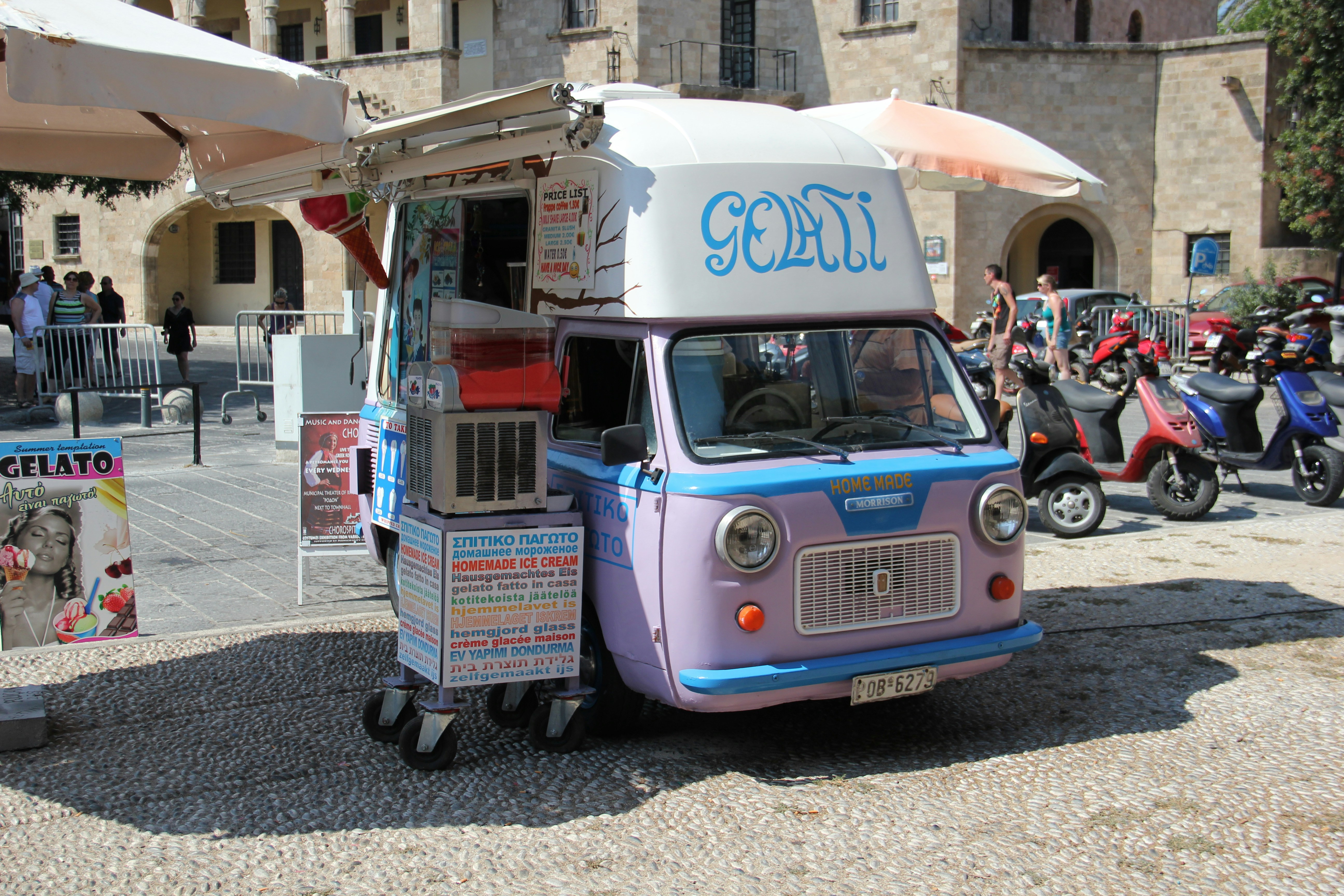 Pastel Popuesa: A Retro Gelato Truck in a Sunlit Piazza
