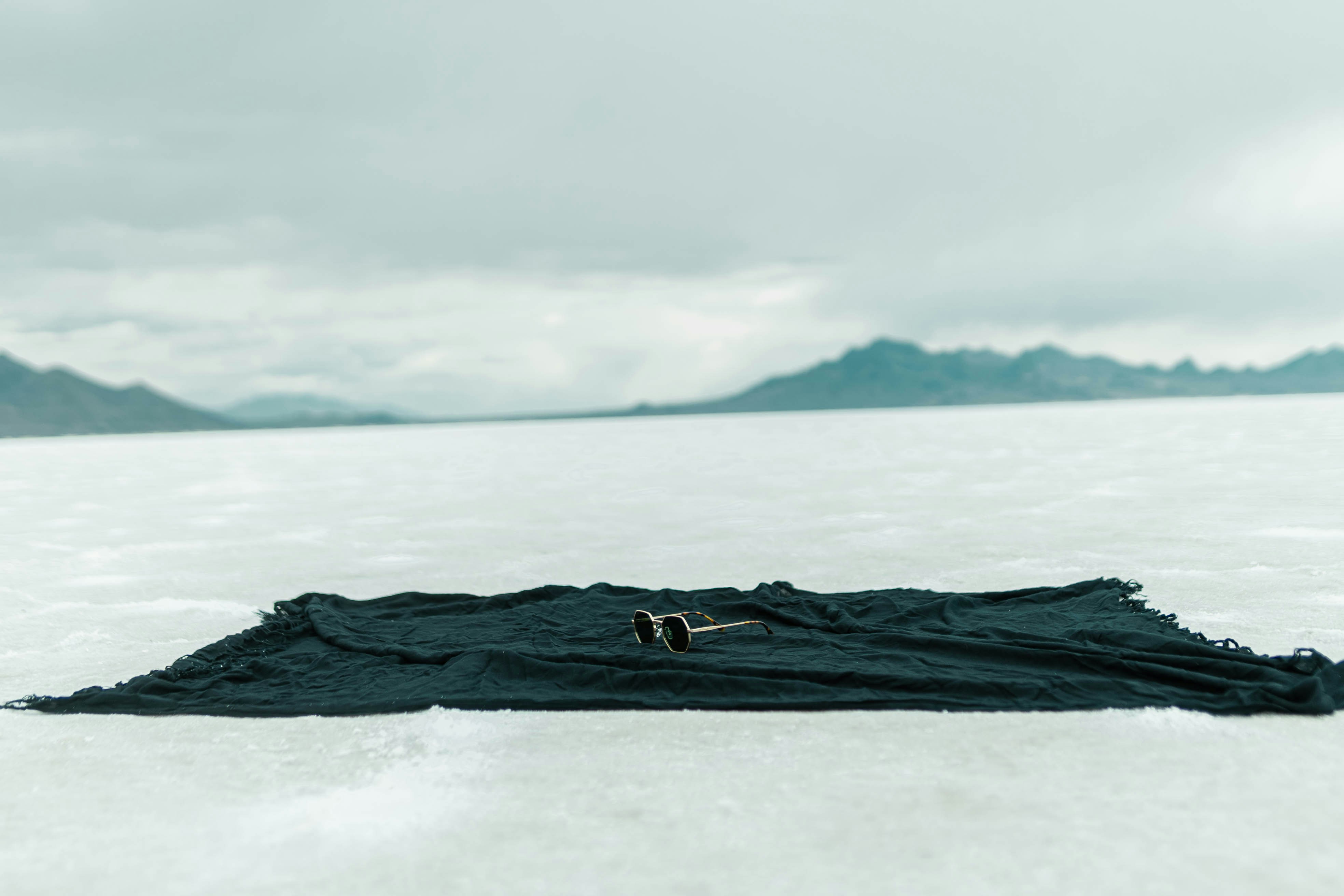 Tranquil Ice Field: A Rugged Cloth Beckons on Silent Vastness