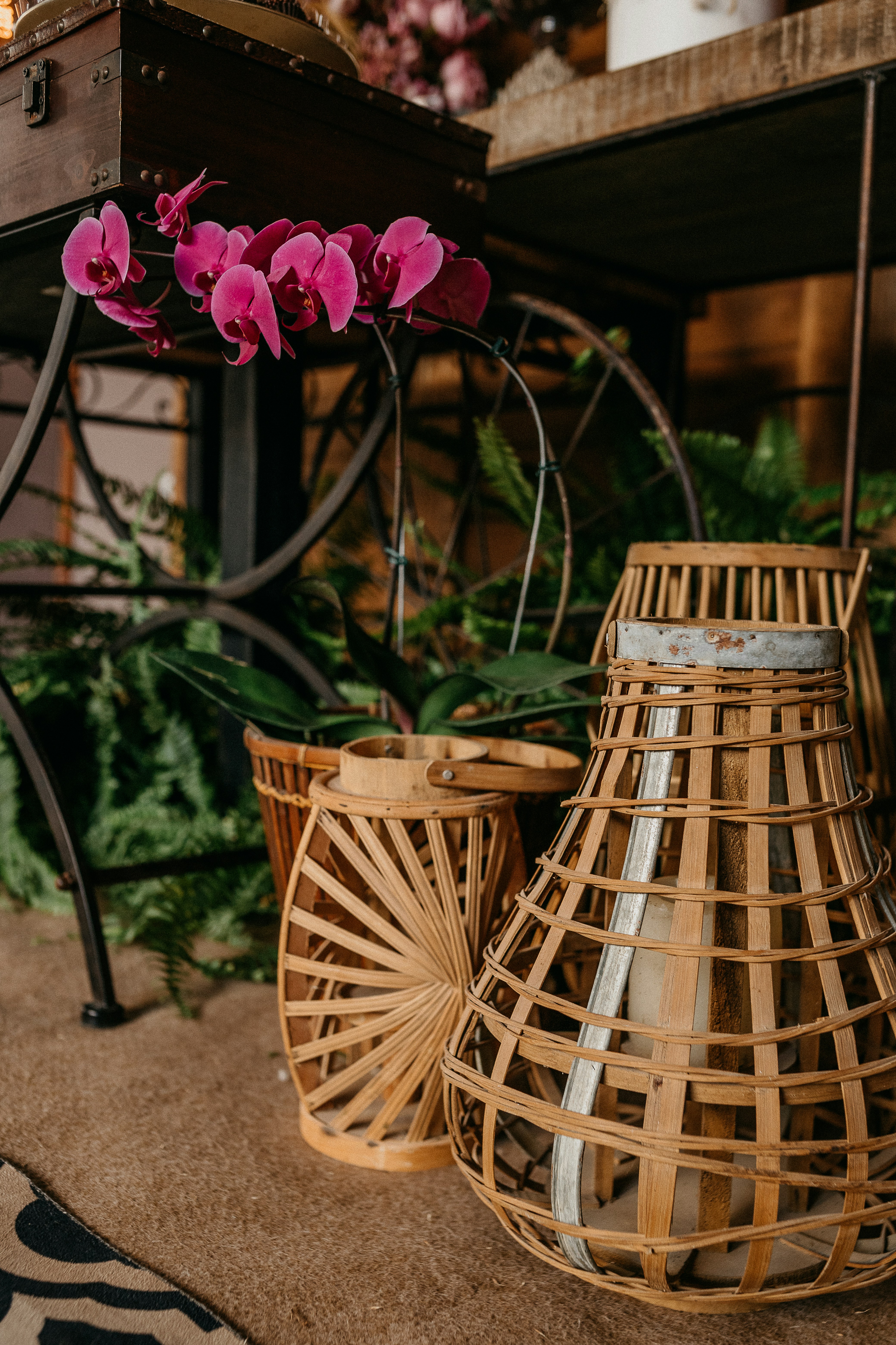 Pink Orchids and Woven Lanterns Under Rustic Shelving