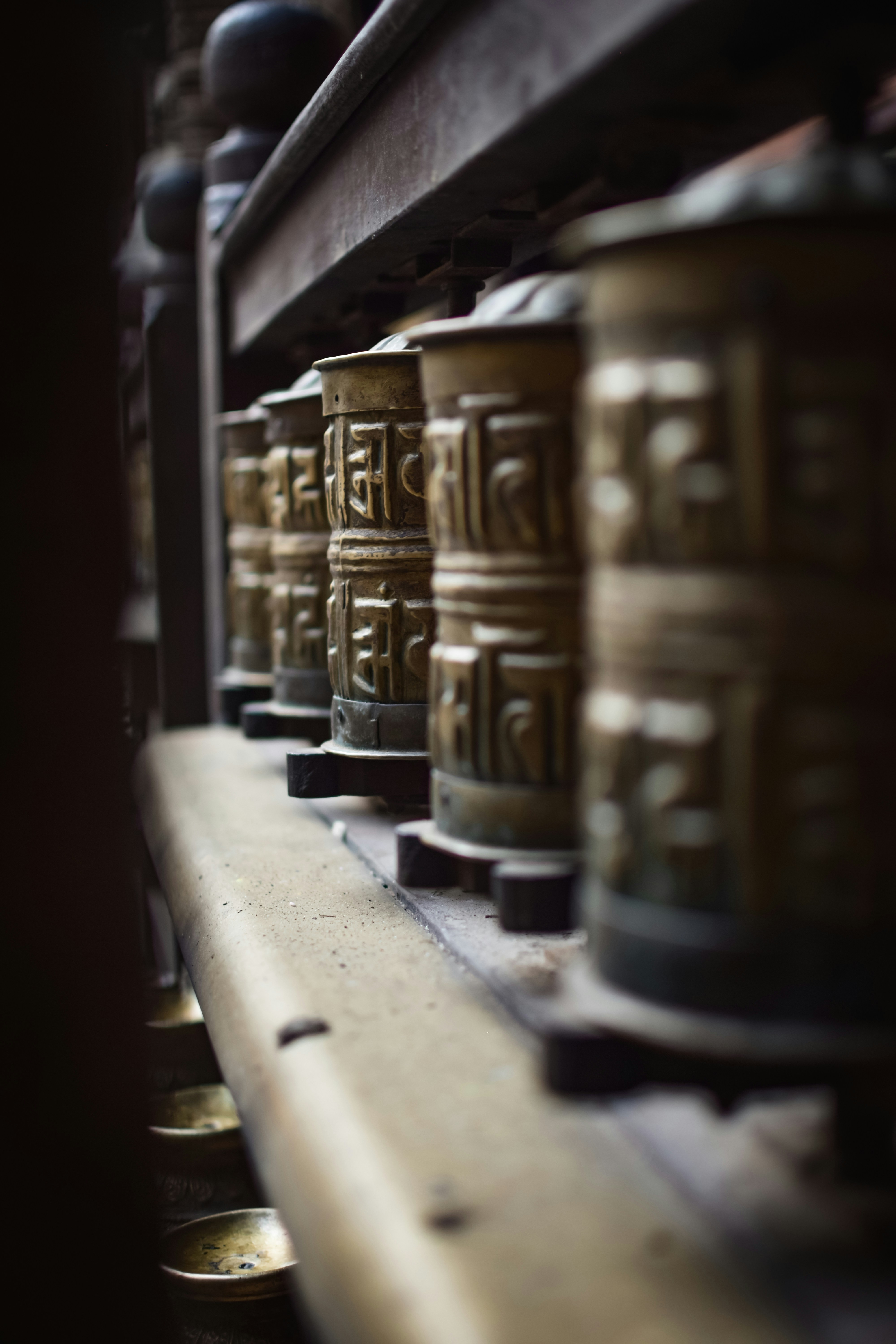 Brass Prayer Wheels: A Quiet Corridor of Script and Light