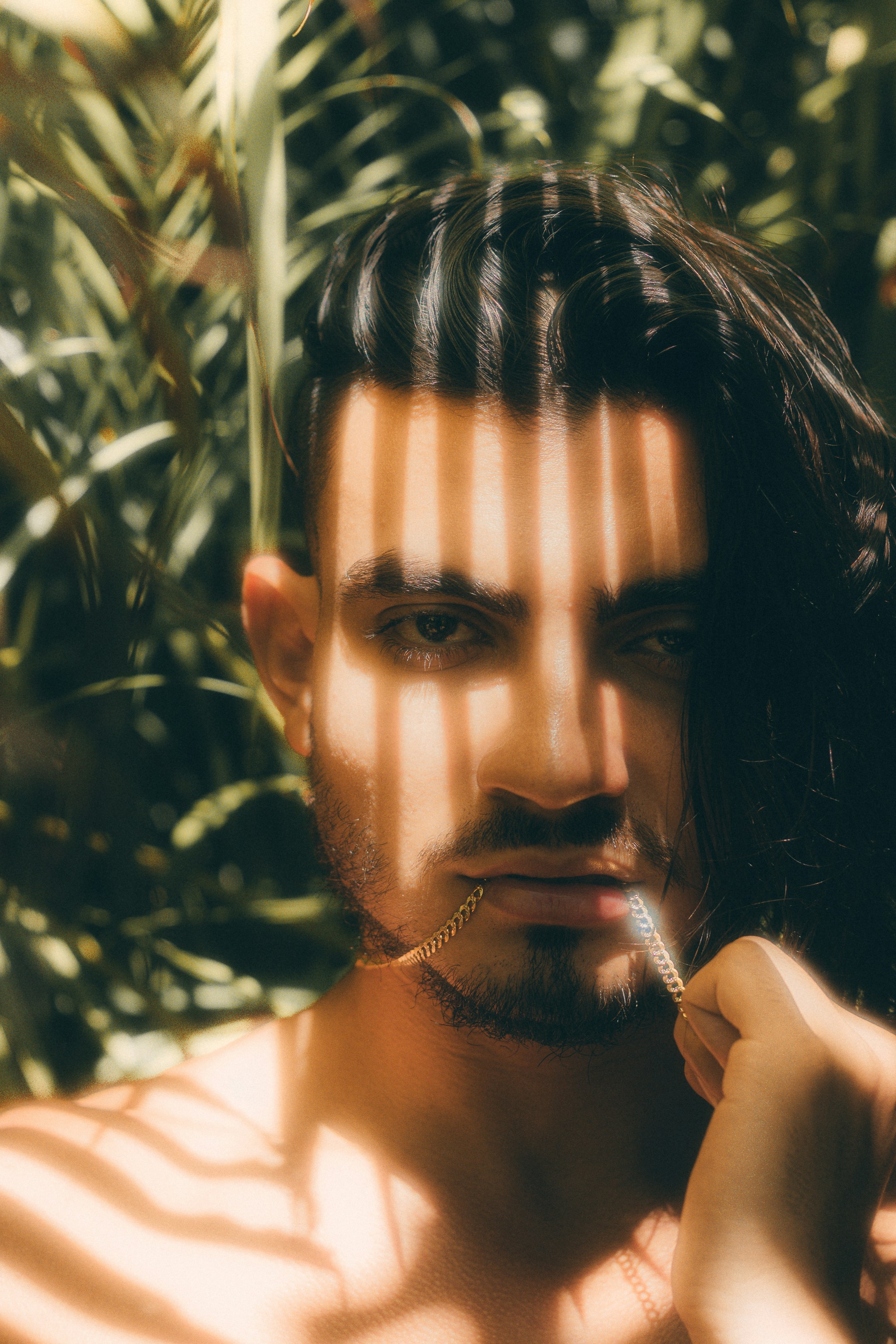 Dappled Gaze: Portrait in Shadowed Stripes